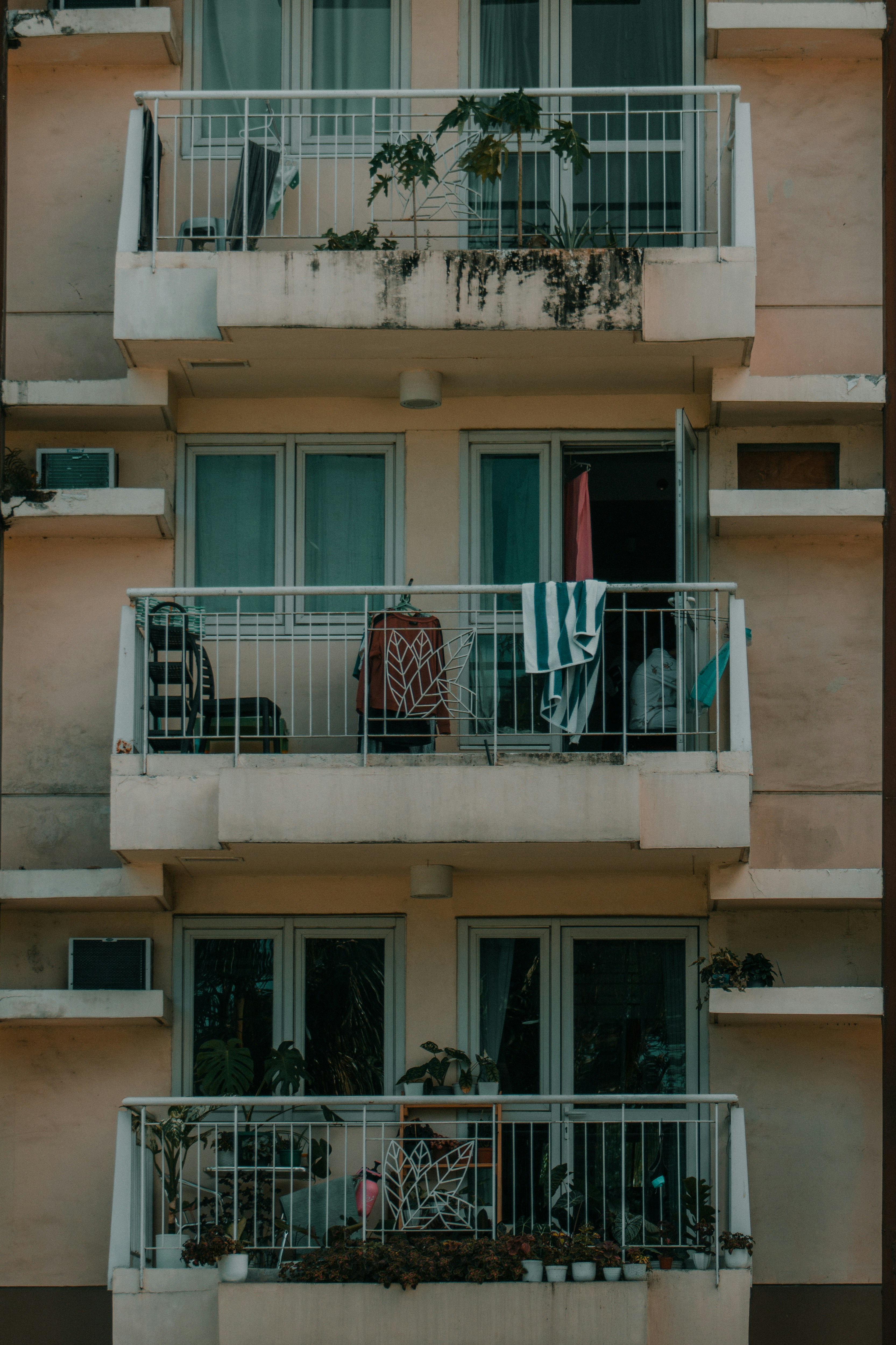 Three Balconies, One Facade: Laundry Lines, Greenery, and Everyday Rhythm