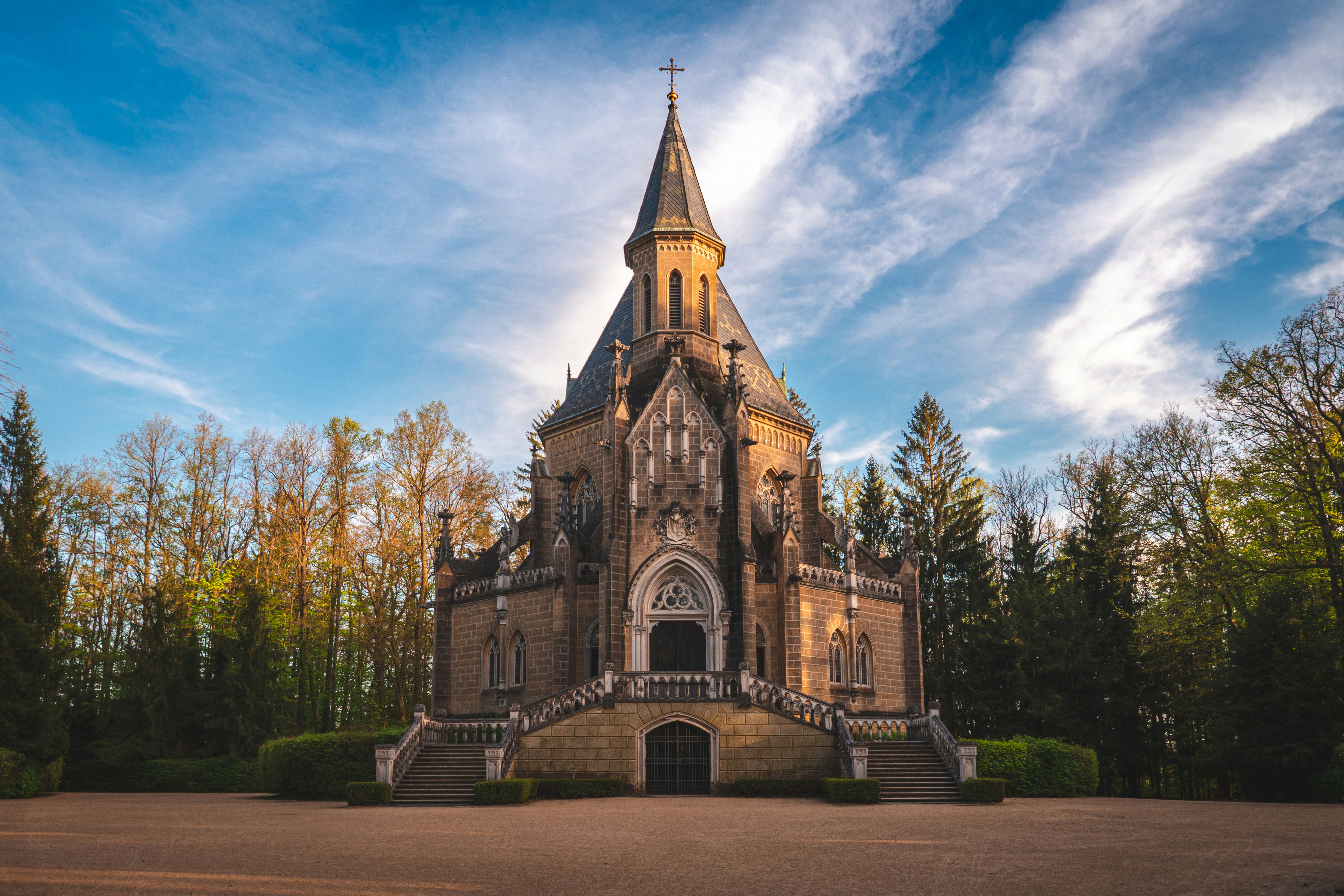 Brown and gray concrete church under blue sky during daytime photo ...