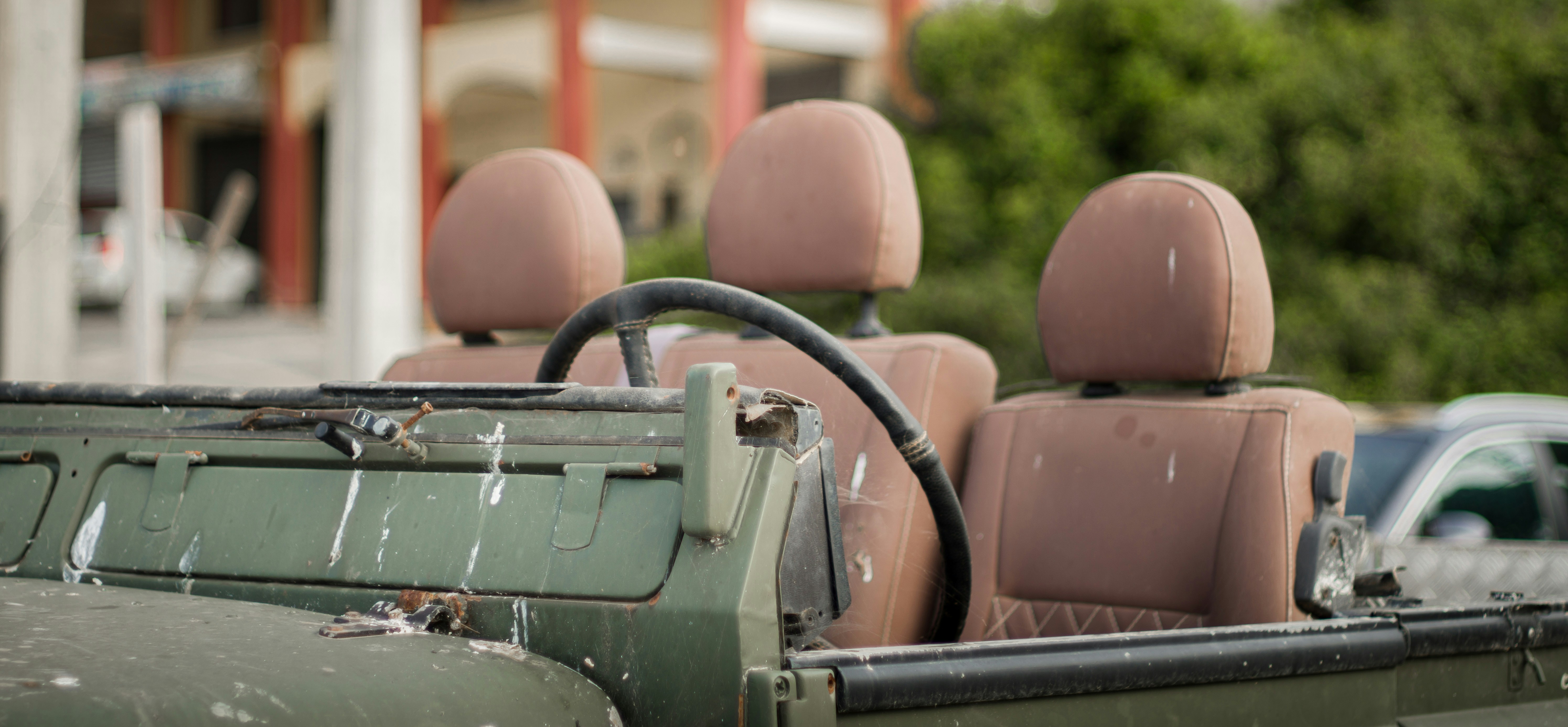 Dirt-Streaked Convertible: Weathered Seats and a Quiet Vista