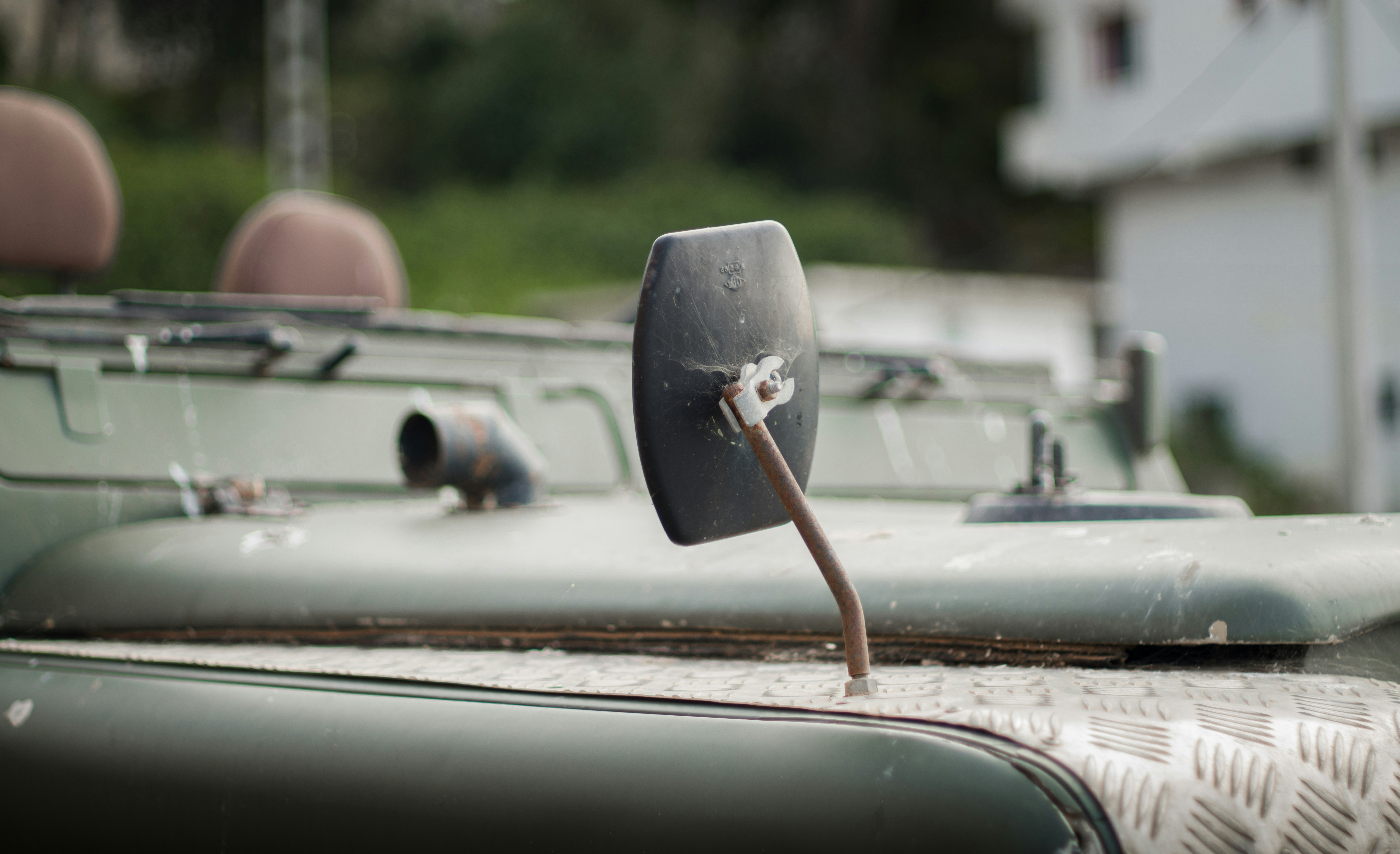 black and brown wooden paddle on car window during daytime