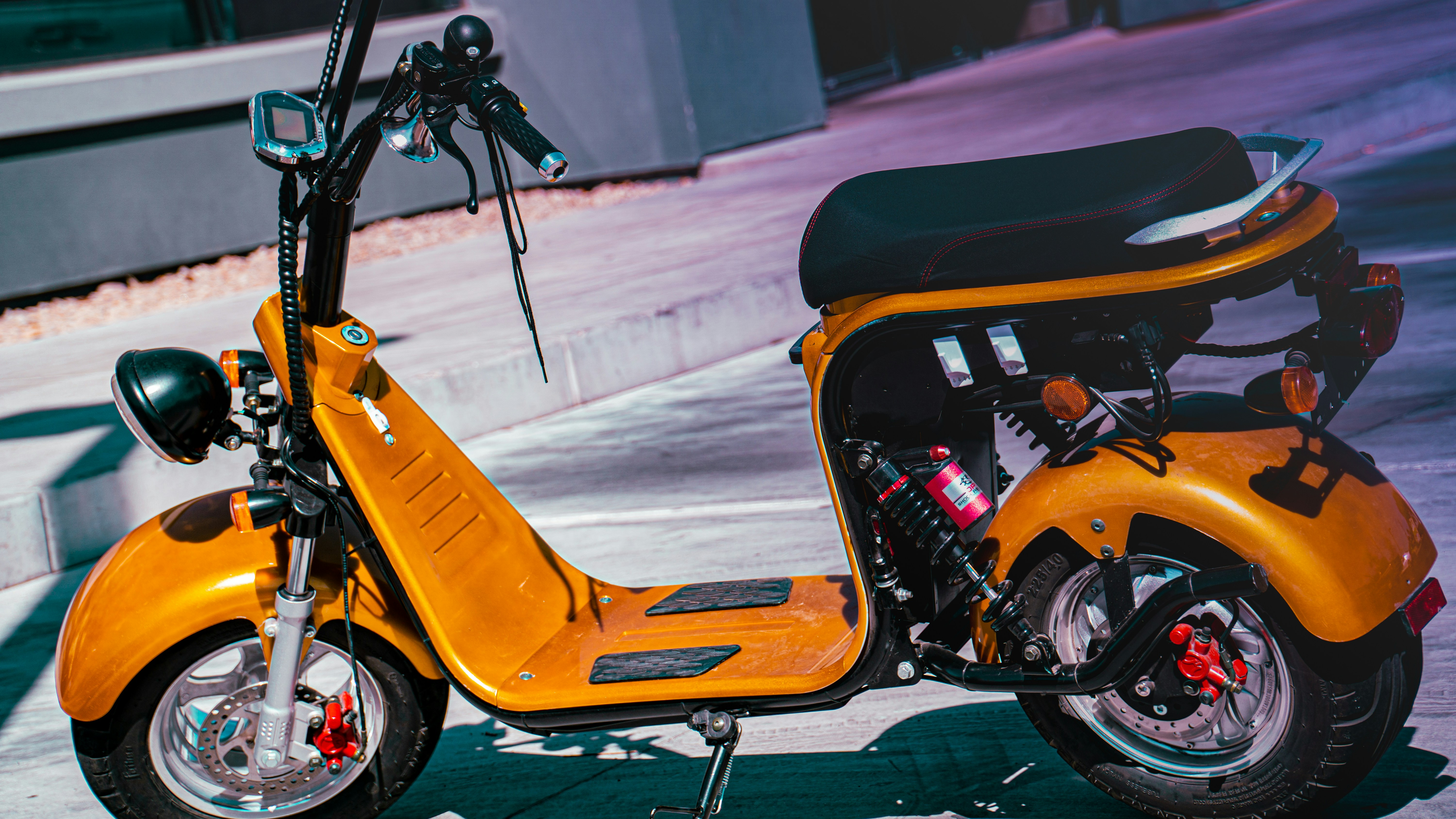 Amber Run: A Vibrant Scooter in Urban Light