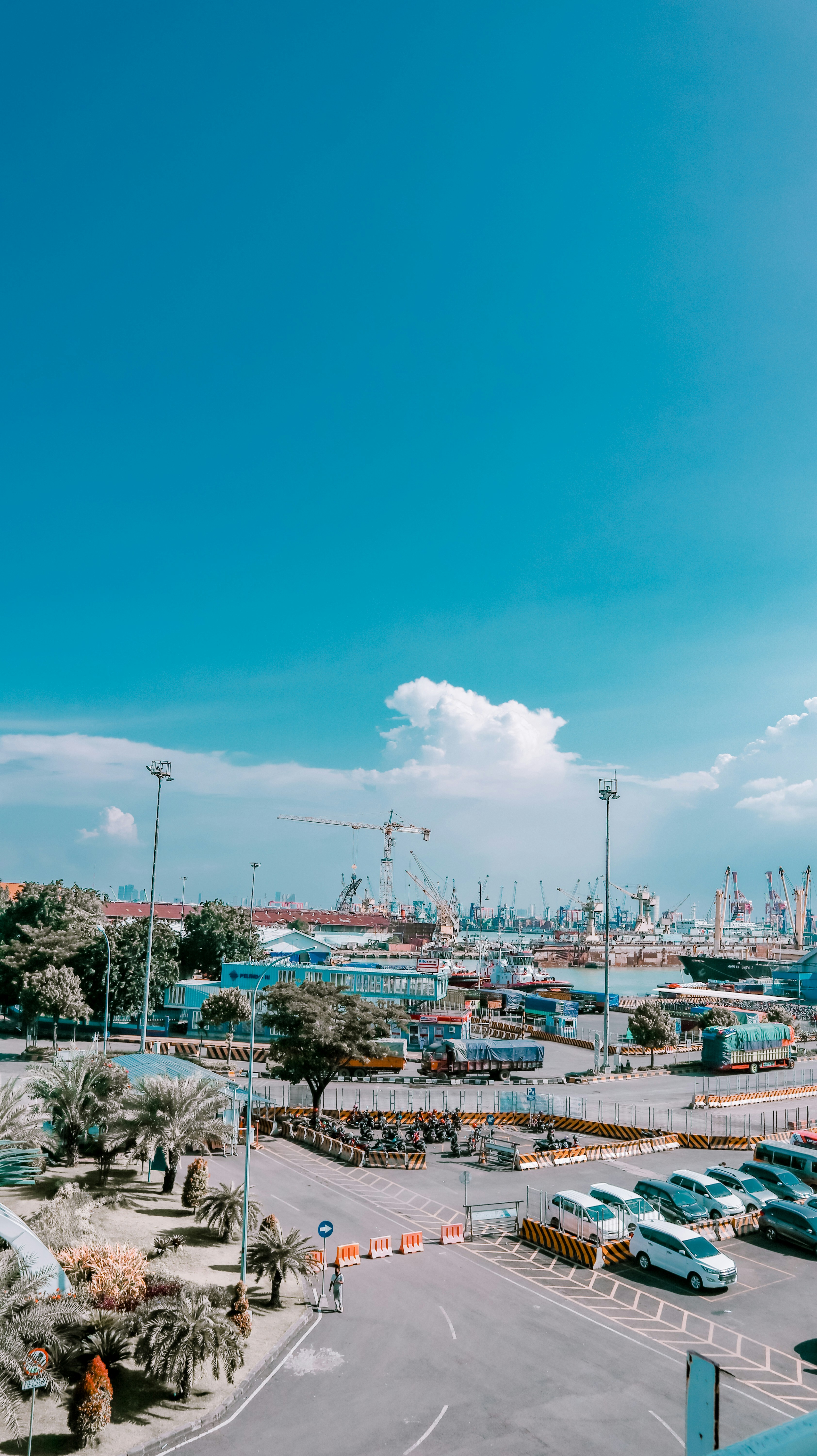 Crane Horizon Over a Sunlit Harbor Industrial Quarter