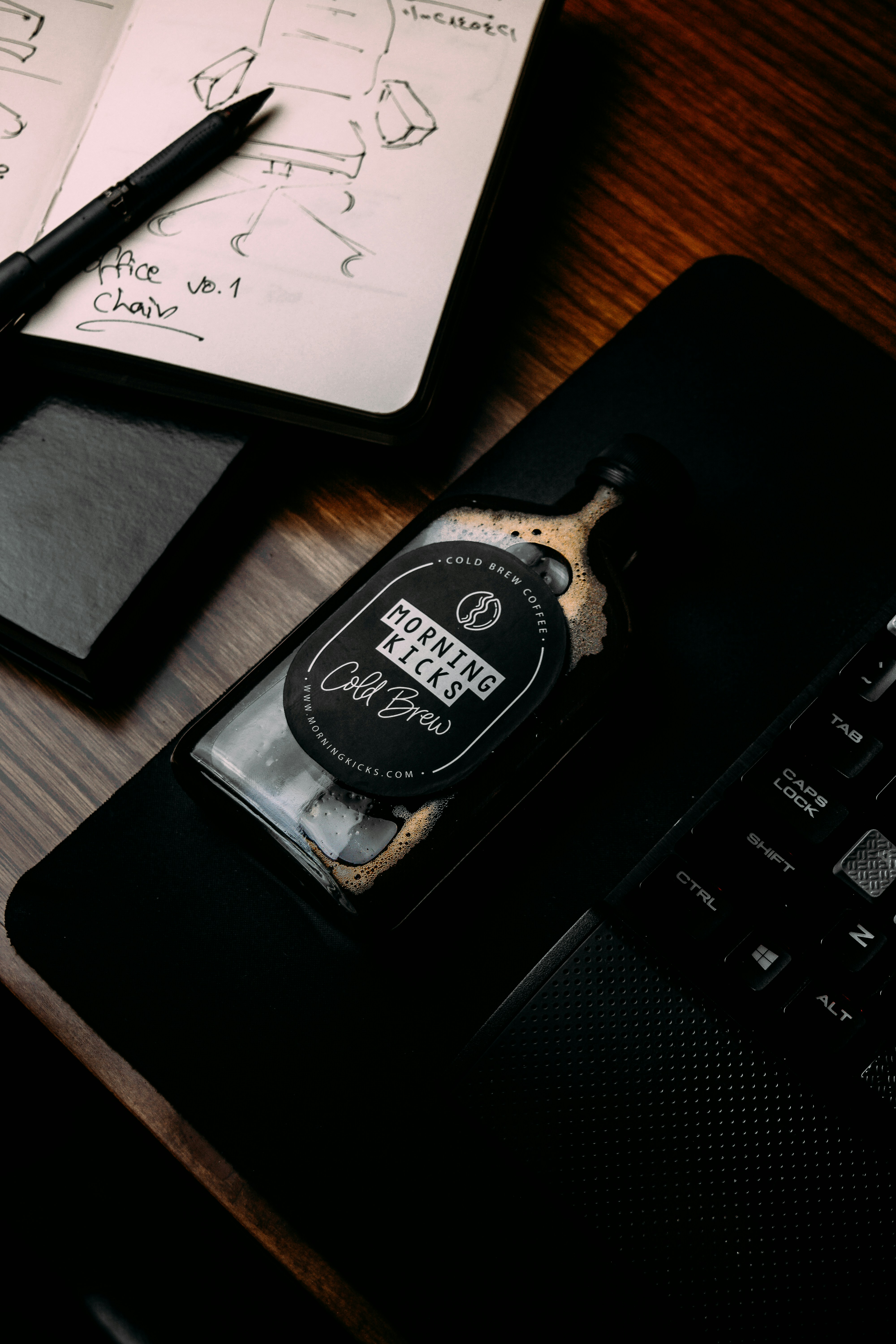 Midnight Brew: a bottle of Morning Kicks rests beside a sketching notebook