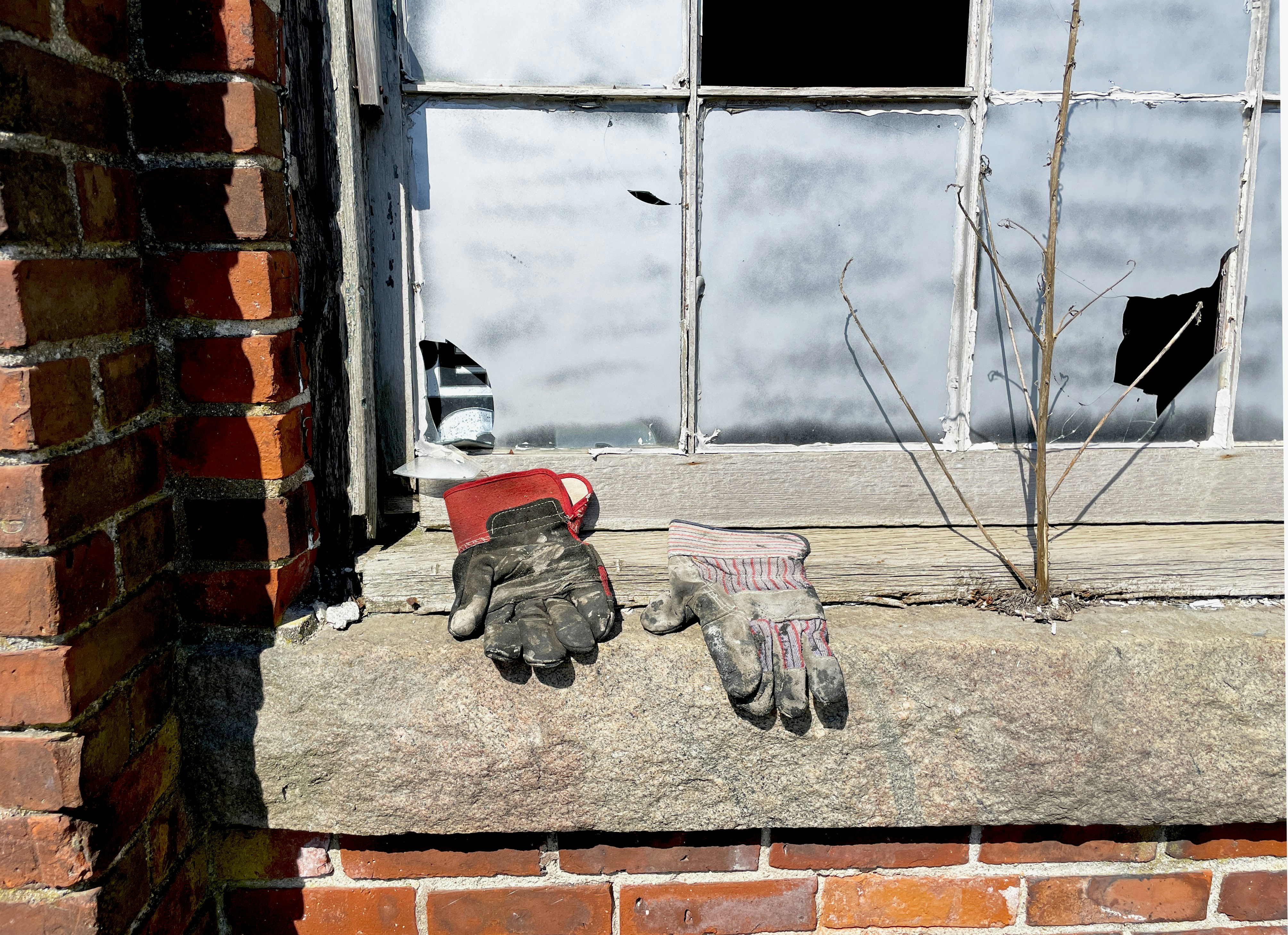 Gloves in the Windowsill: Quiet Echoes of a Ruined Workshop