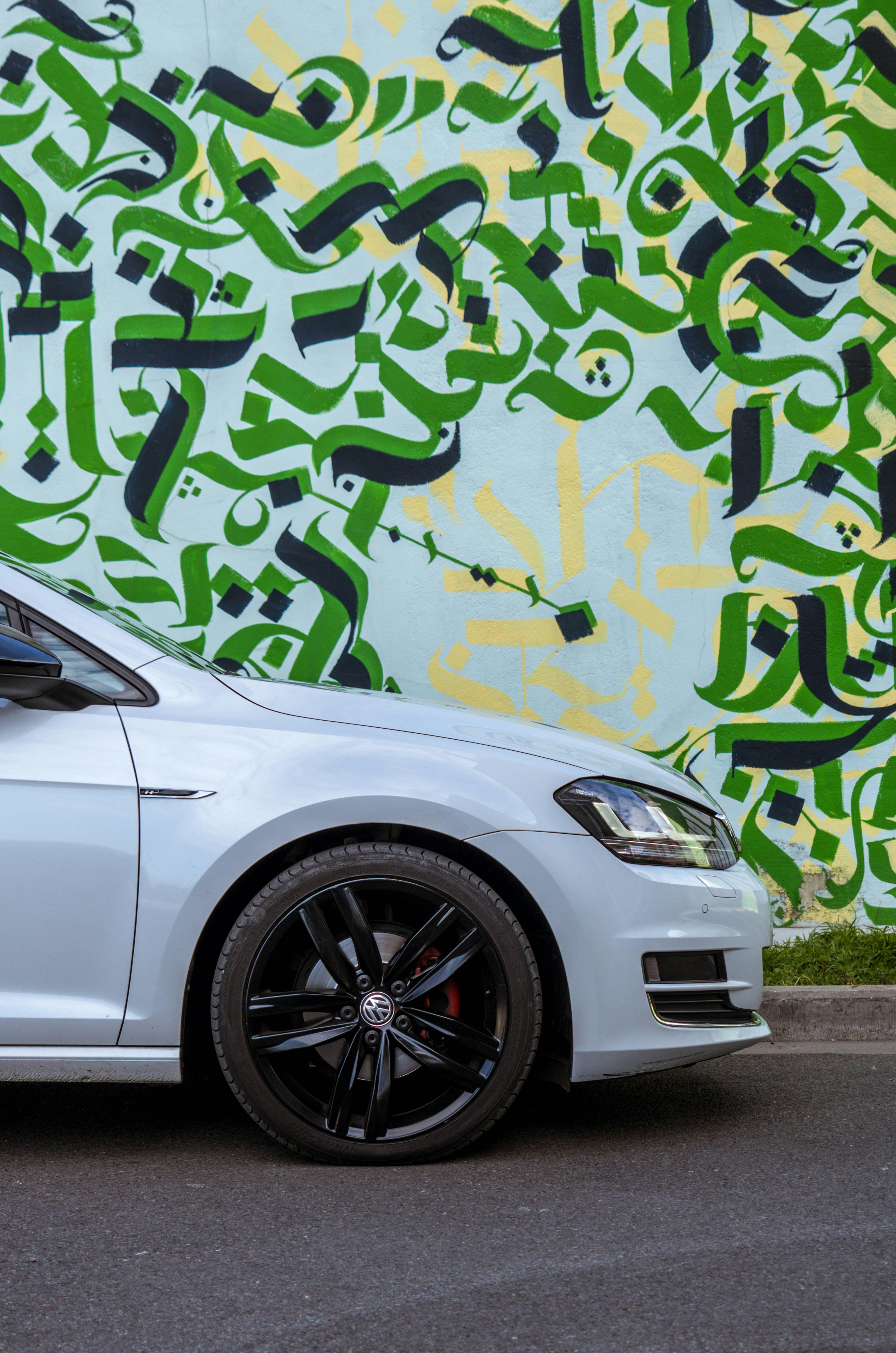Street-Stop: A Silver VW Combines with Graffiti Richness