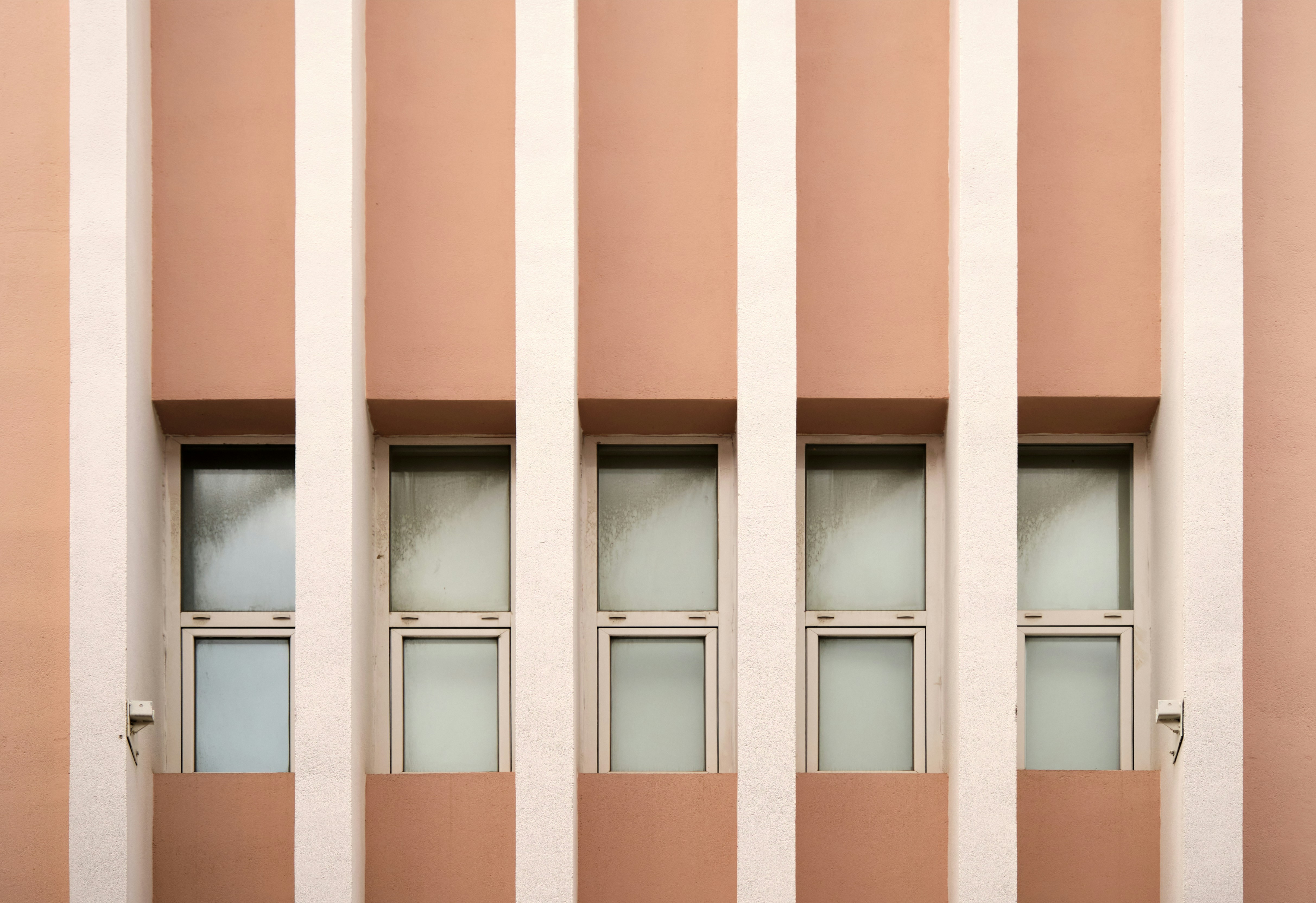 White lines on pastel pink background