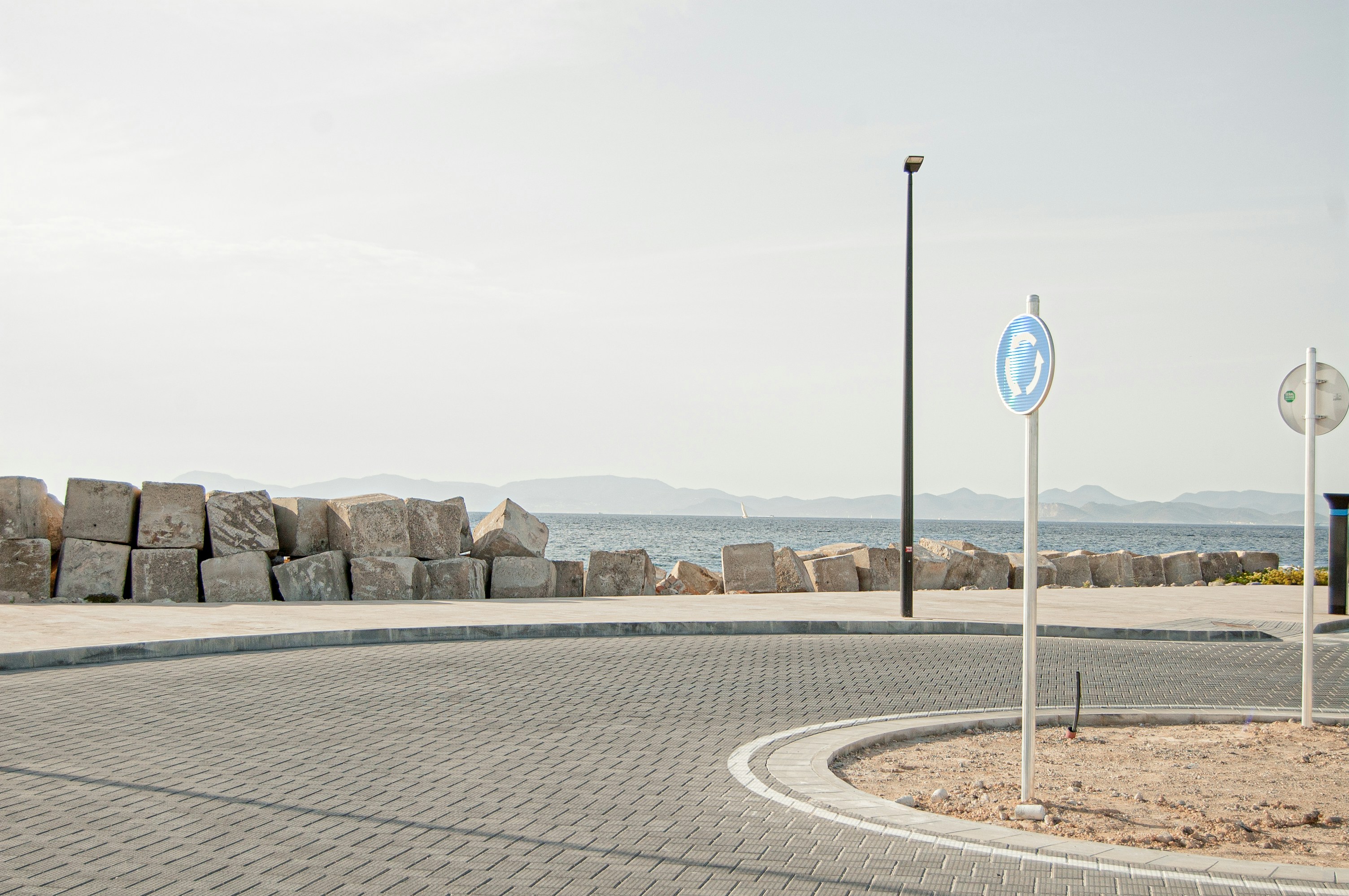 white and blue road sign