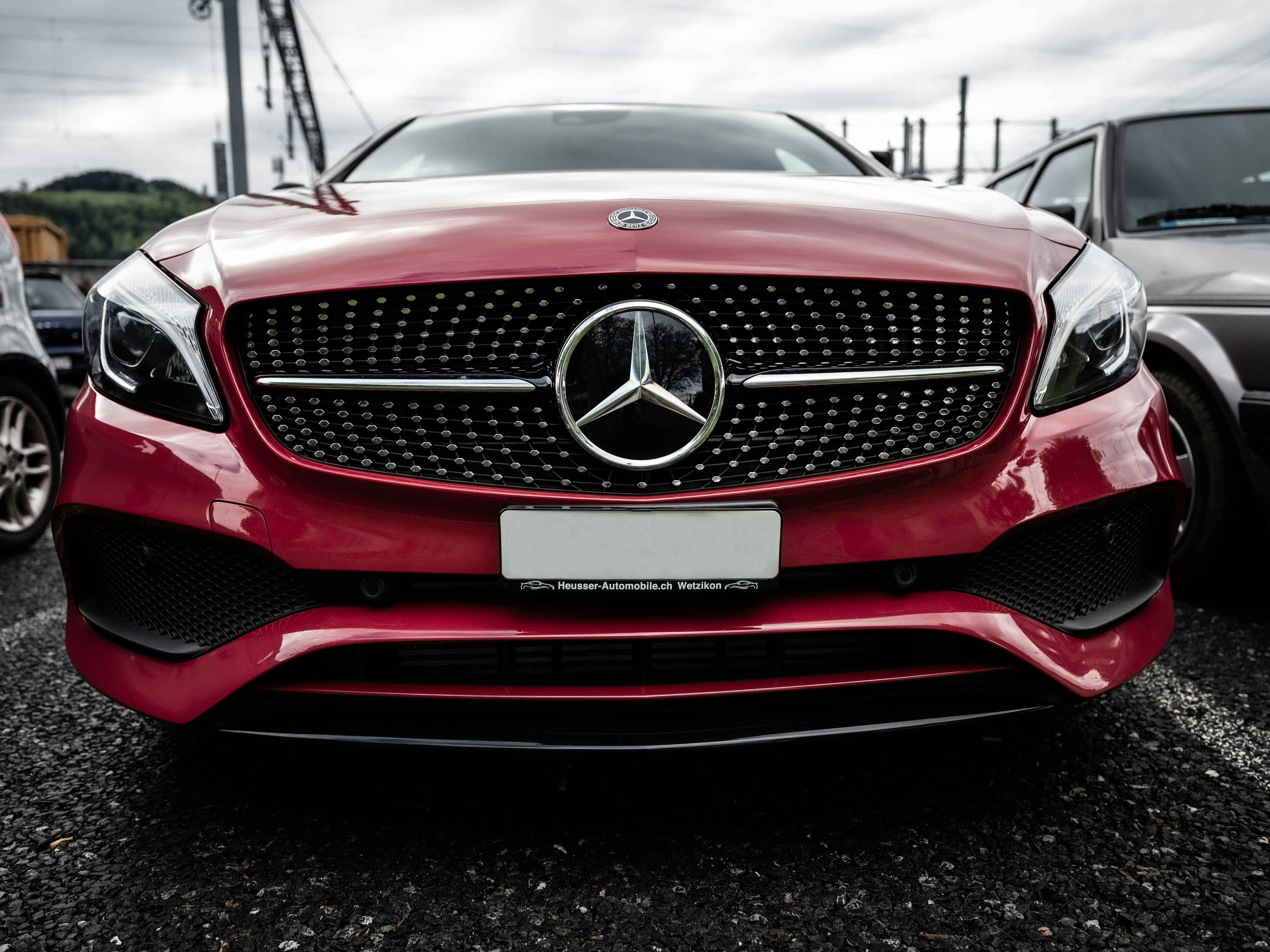 Red mercedes benz car on road photo – Free Blury Image on Unsplash