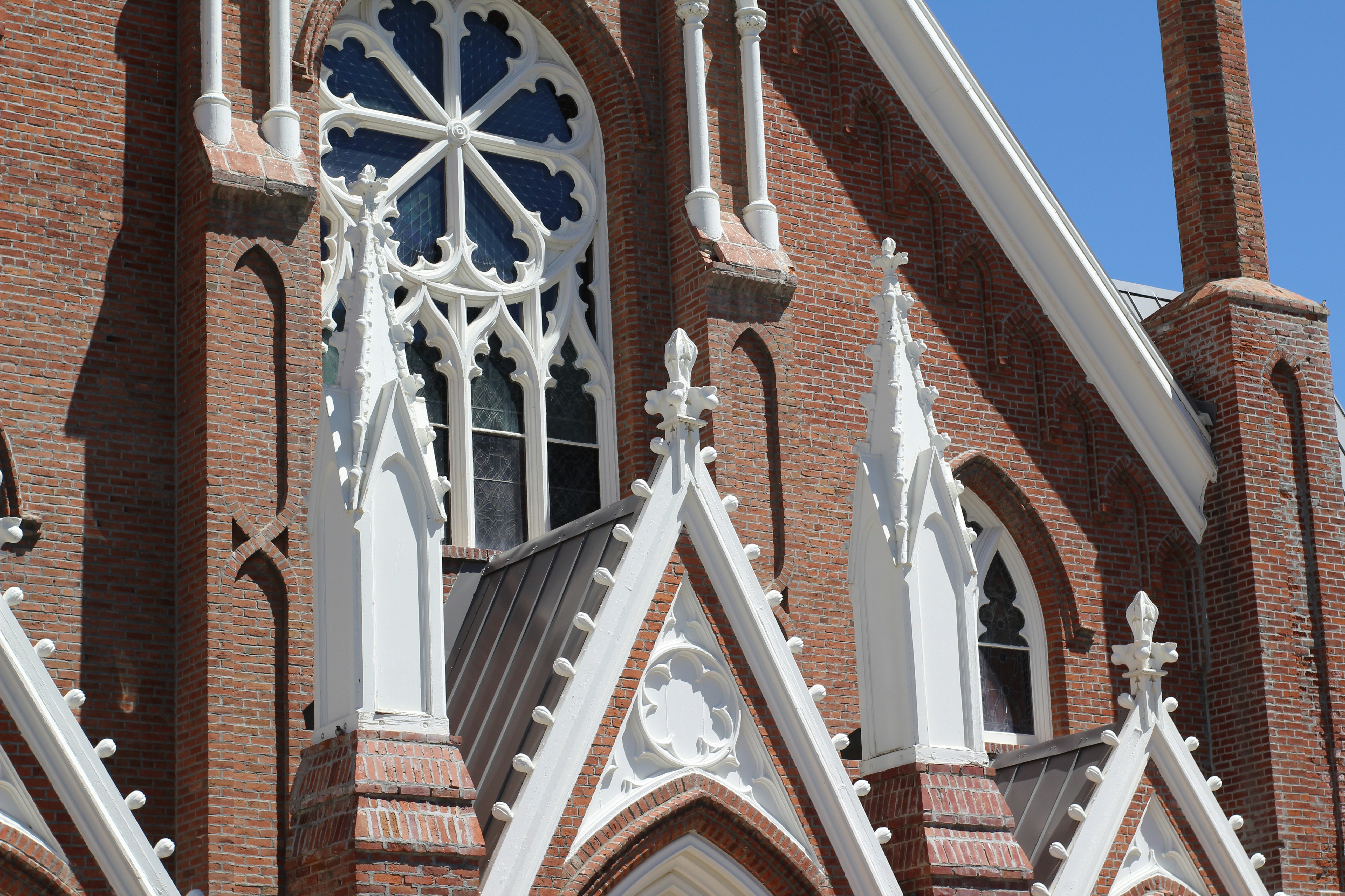 Gothic Revival Facade: White Tracery Against Red Brick