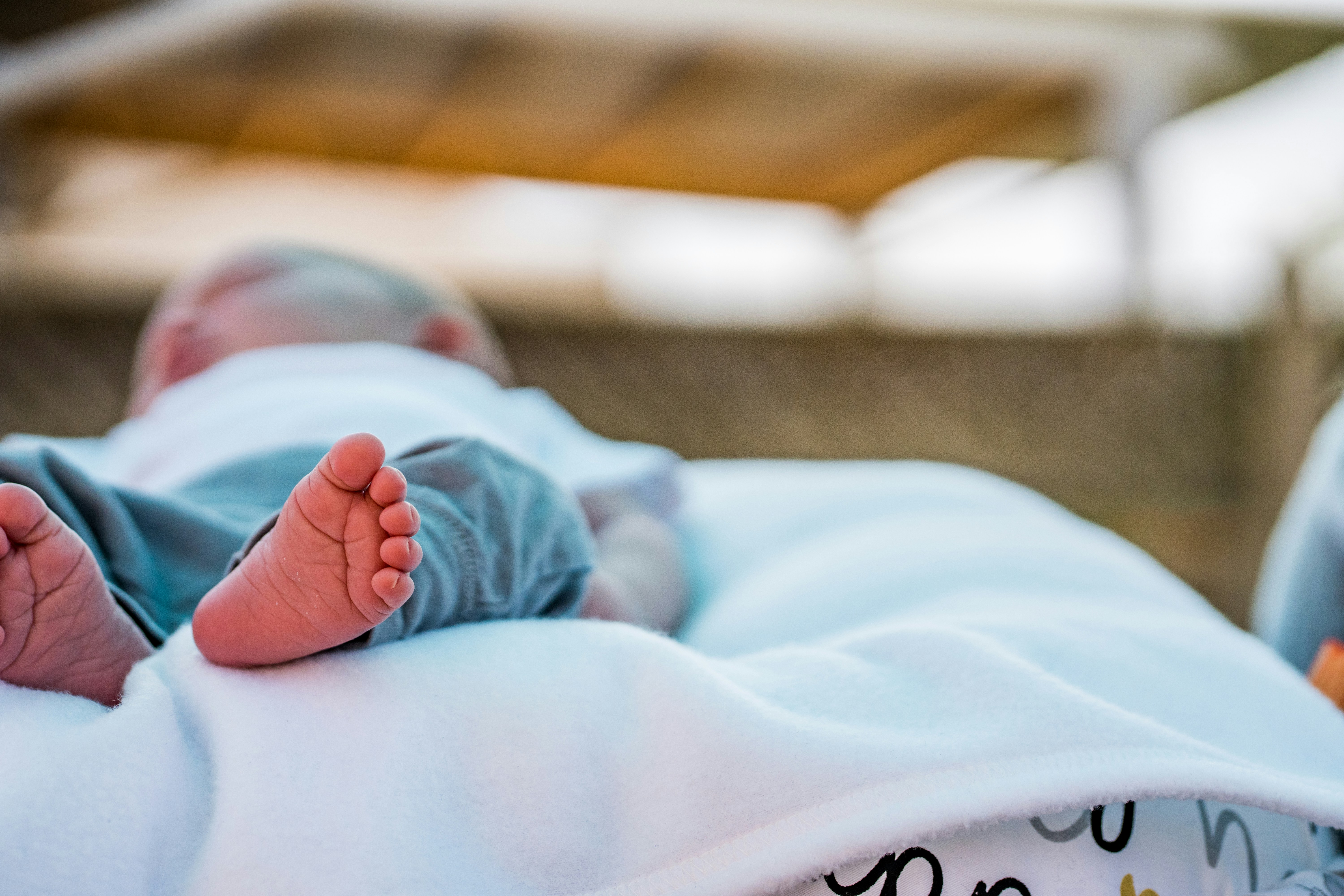 Tiny Toes in Soft Outdoor Light: A Quiet Blanket Moment