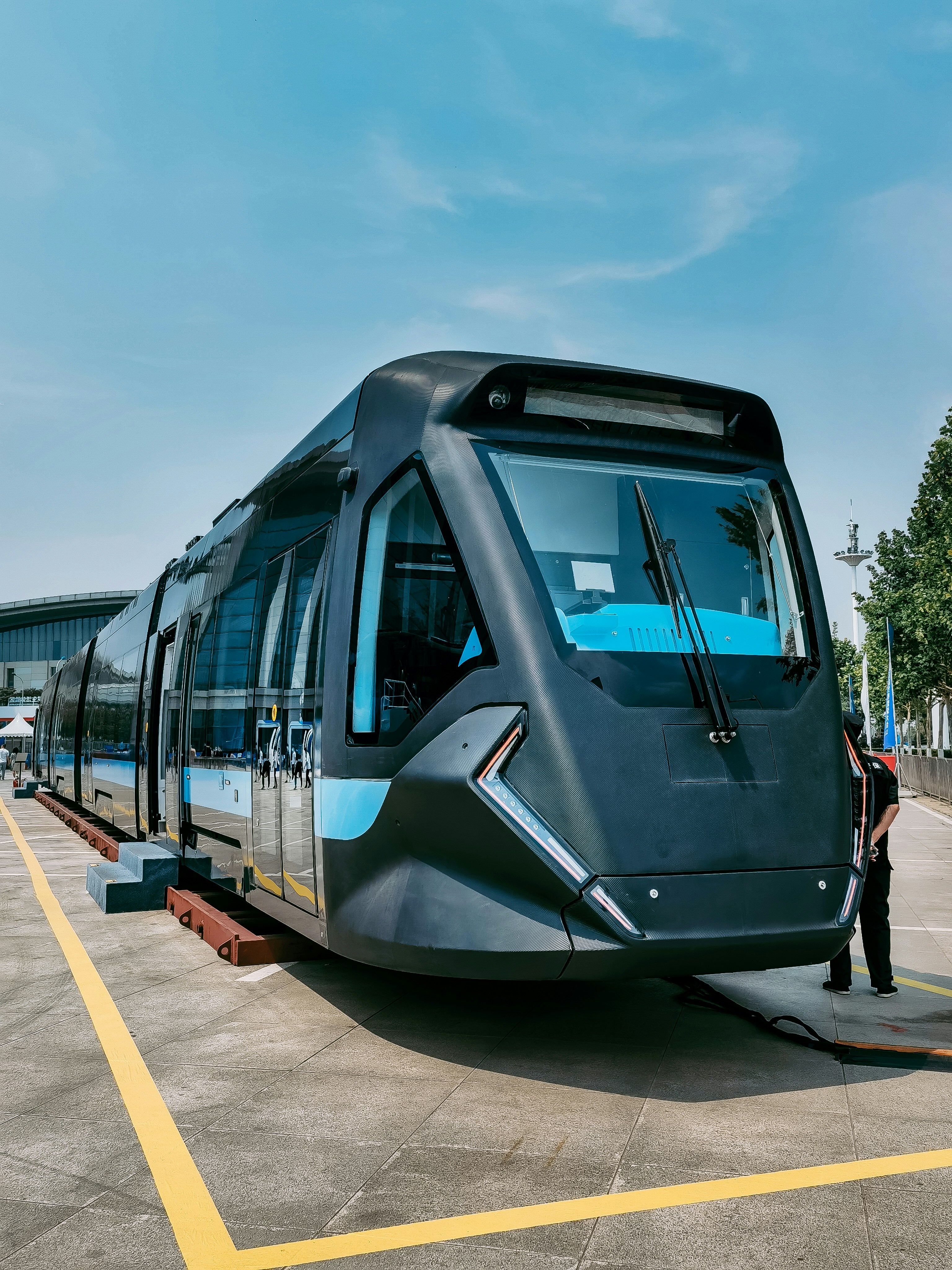 blue and white train on rail road during daytime