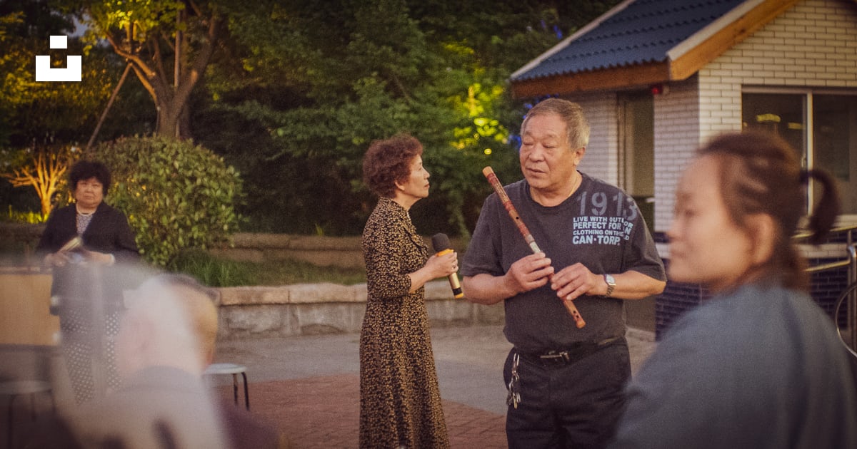 Man In Black Crew Neck T Shirt Holding Brown Stick Photo Free Human
