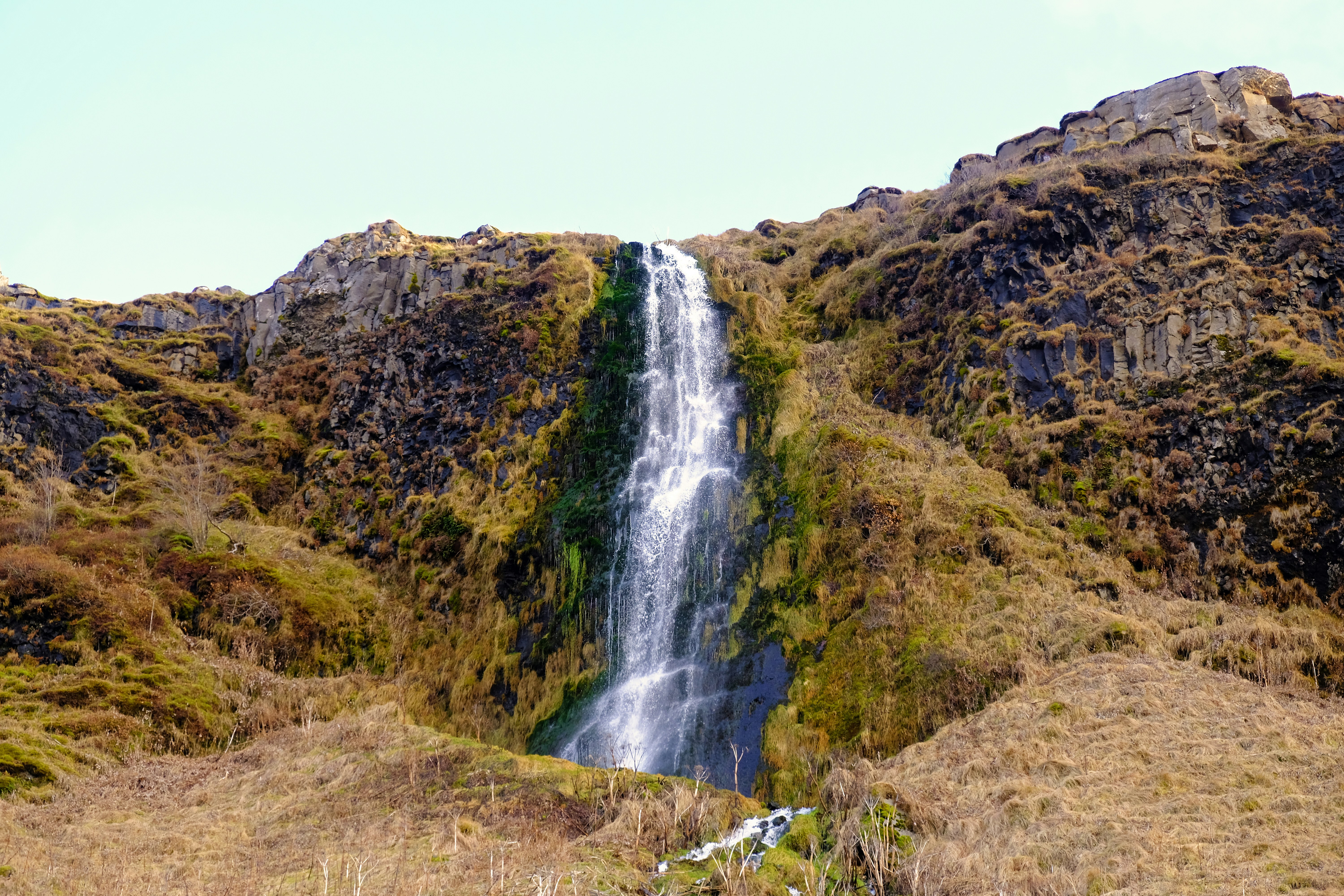 Cliffside Cascade: Moss and Light