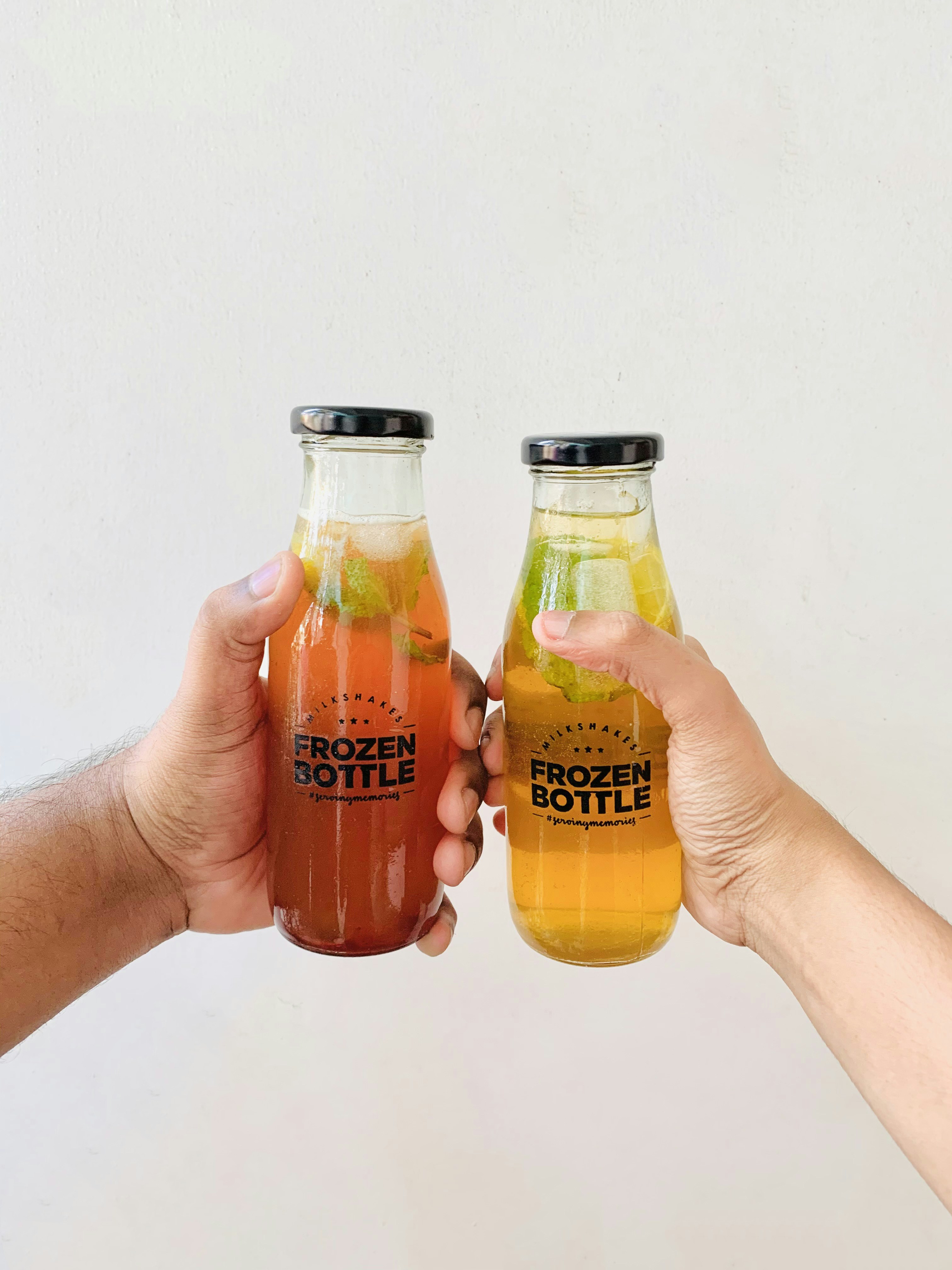 Juice bottle in hands
