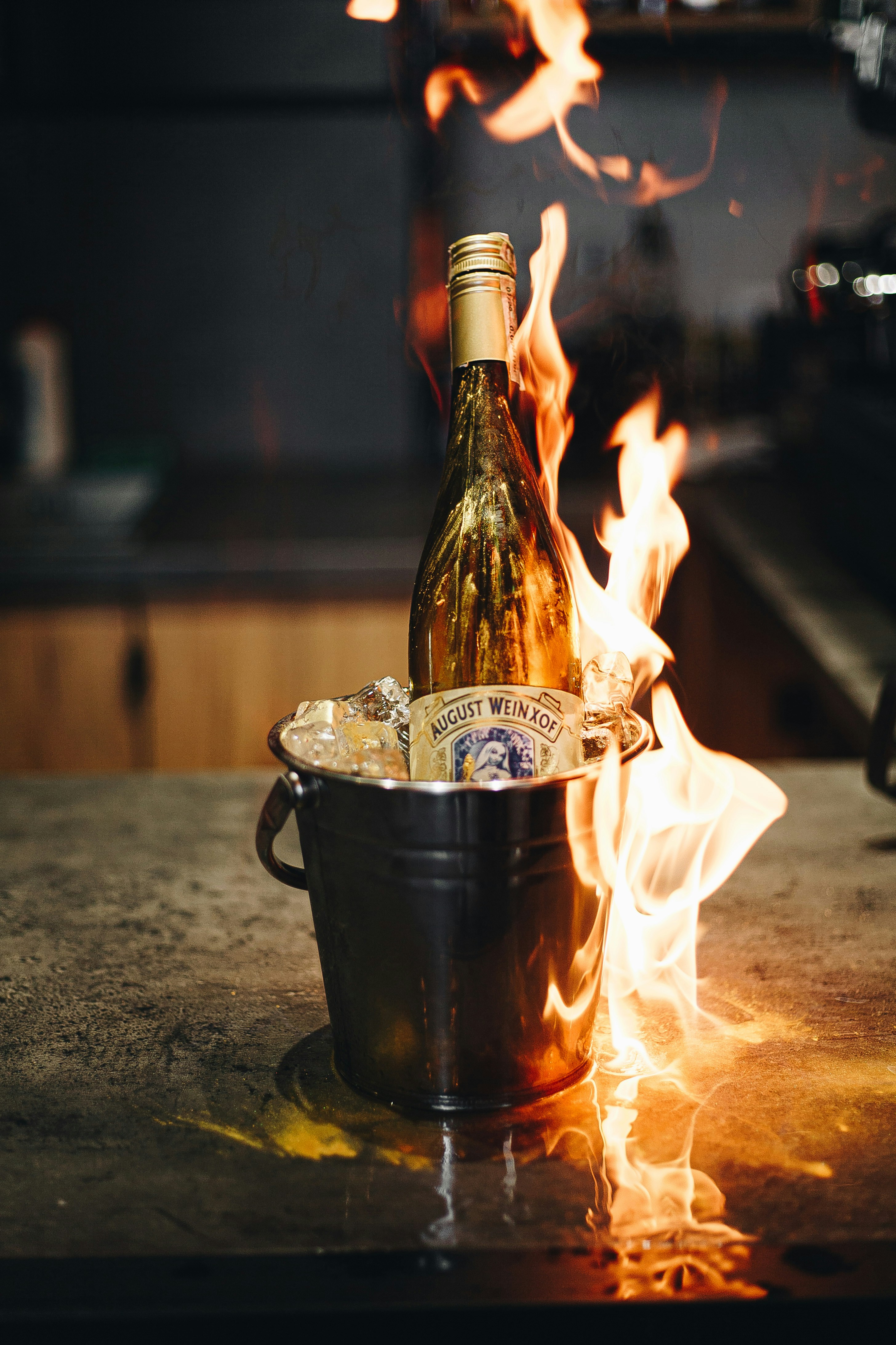 Ember-Bottled Illumination: Flames, Ice, and a Wine Bottle