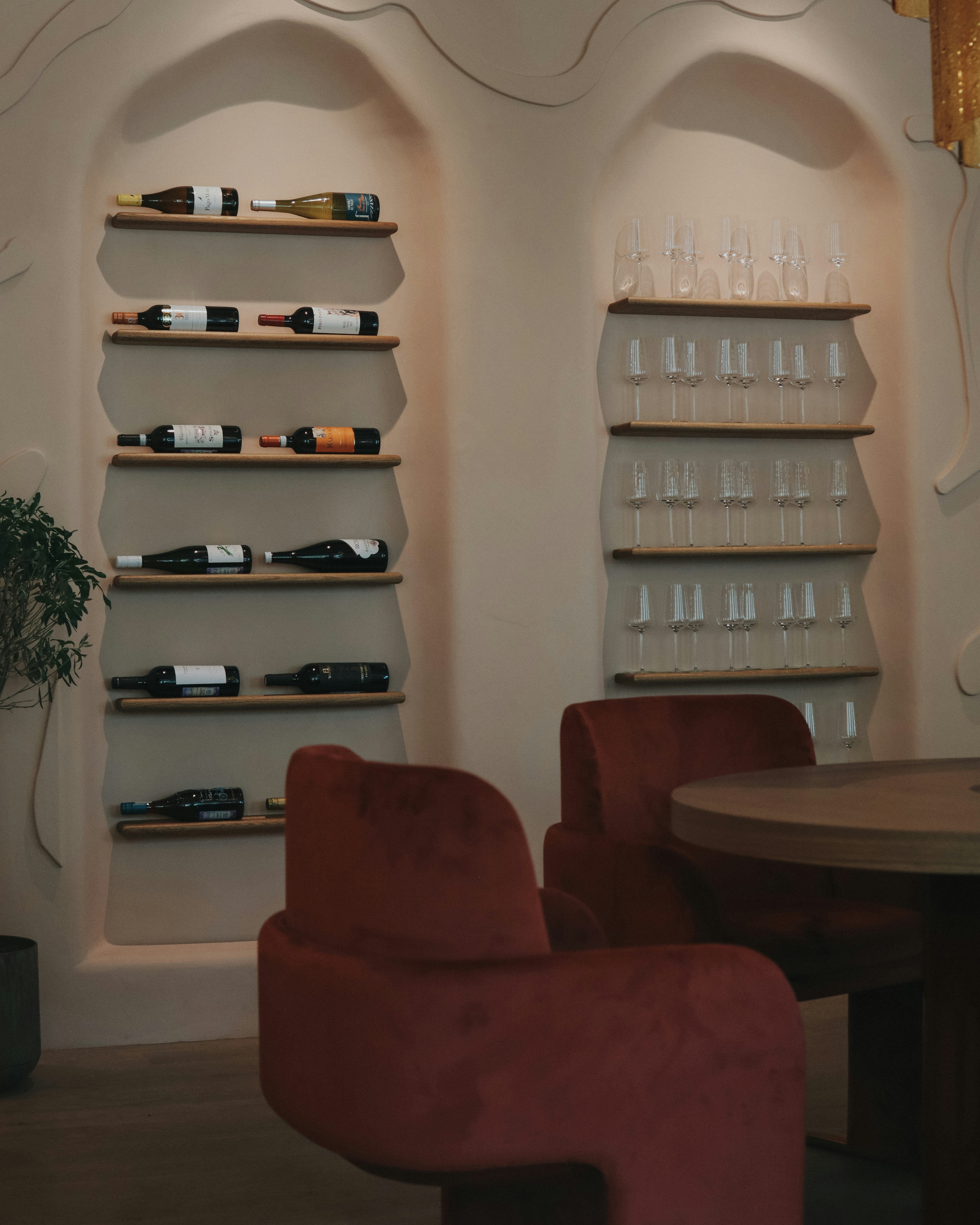 Wine Wall and Velvet Chairs in a Modern Tasting Room