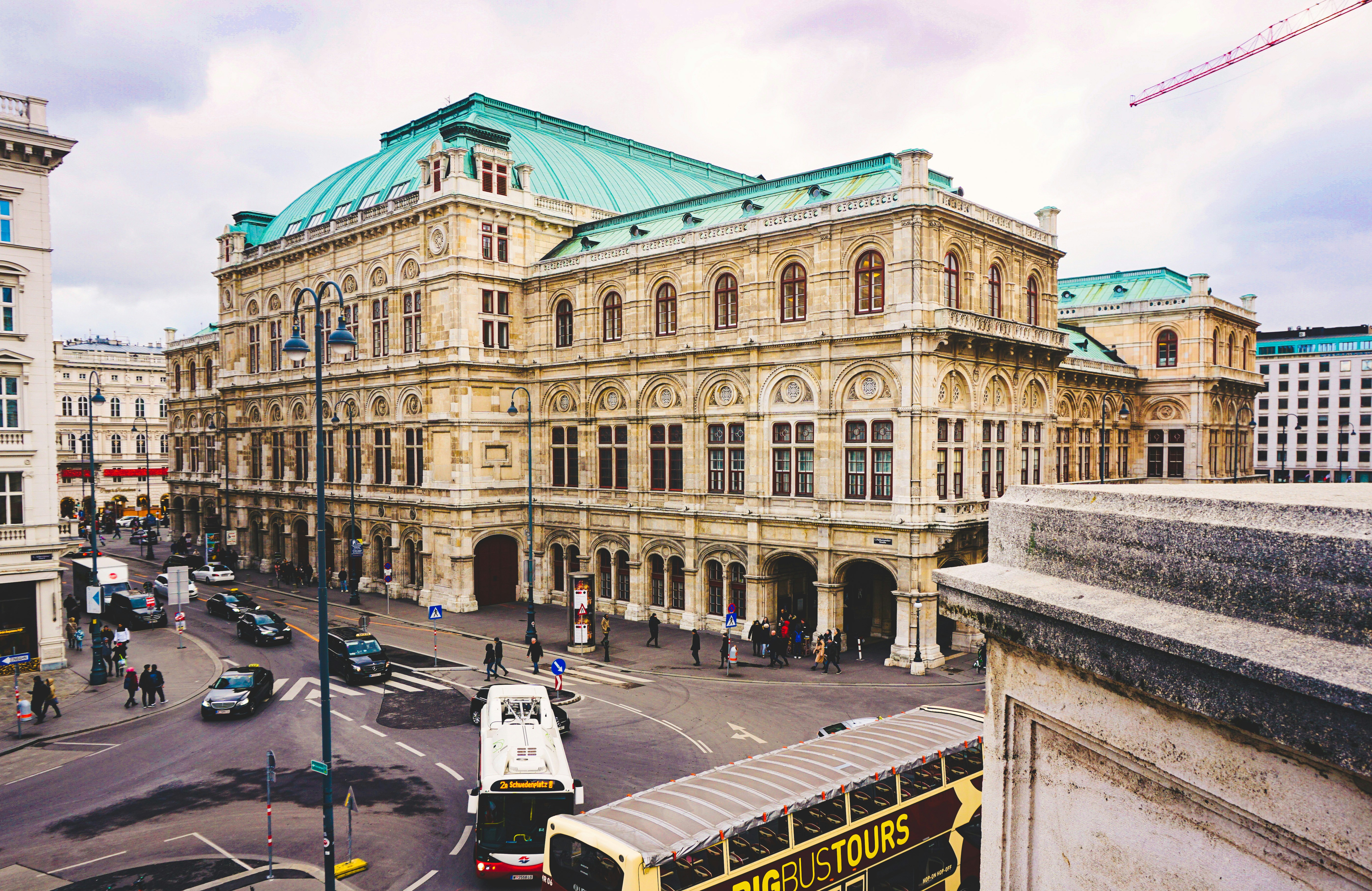 Facing Vienna state opera, albertina museum (Before Sunrise) | cars parked in front of beige concrete building during daytime