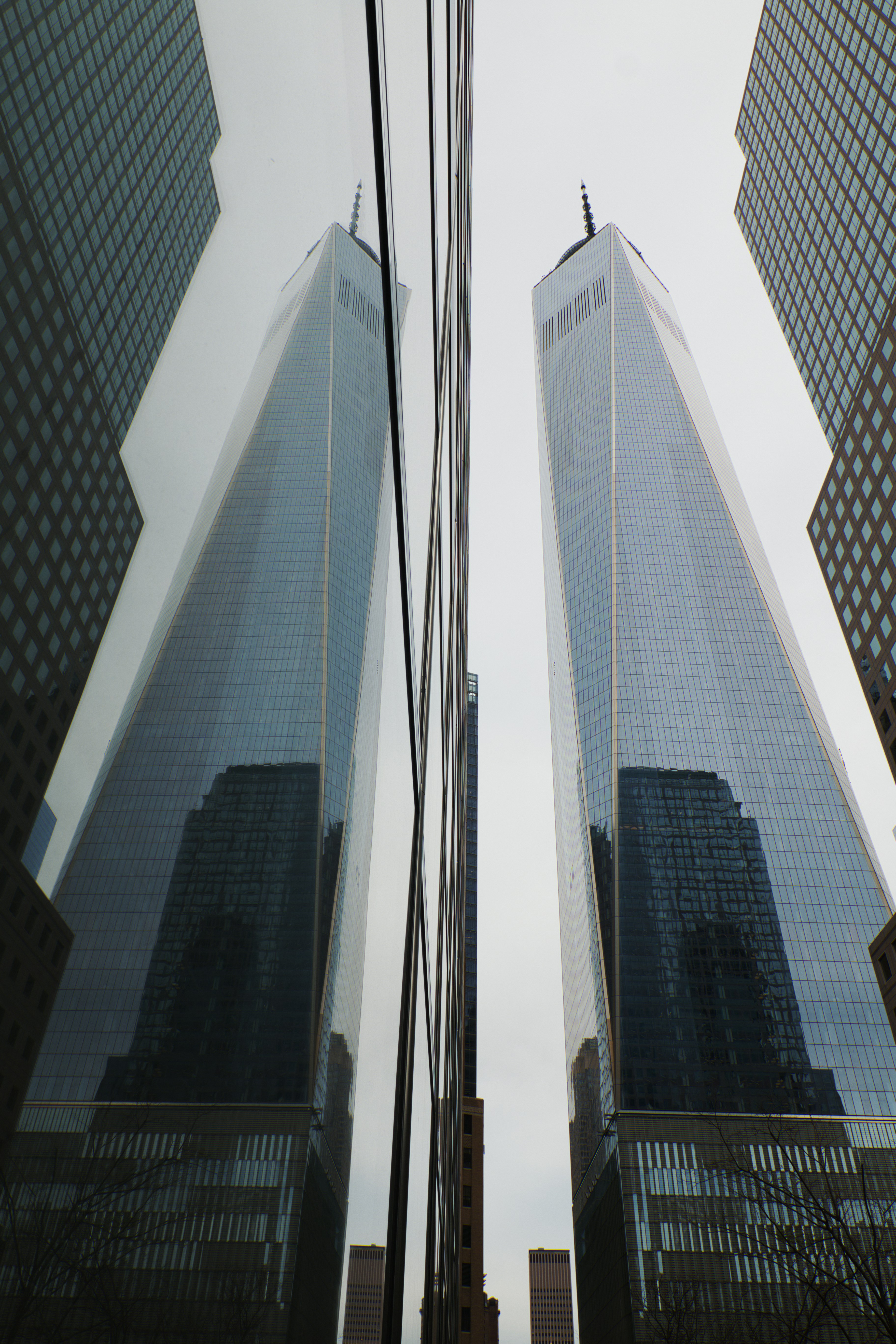 Split Reflections: Twin Glass Giants Reaching for the Sky
