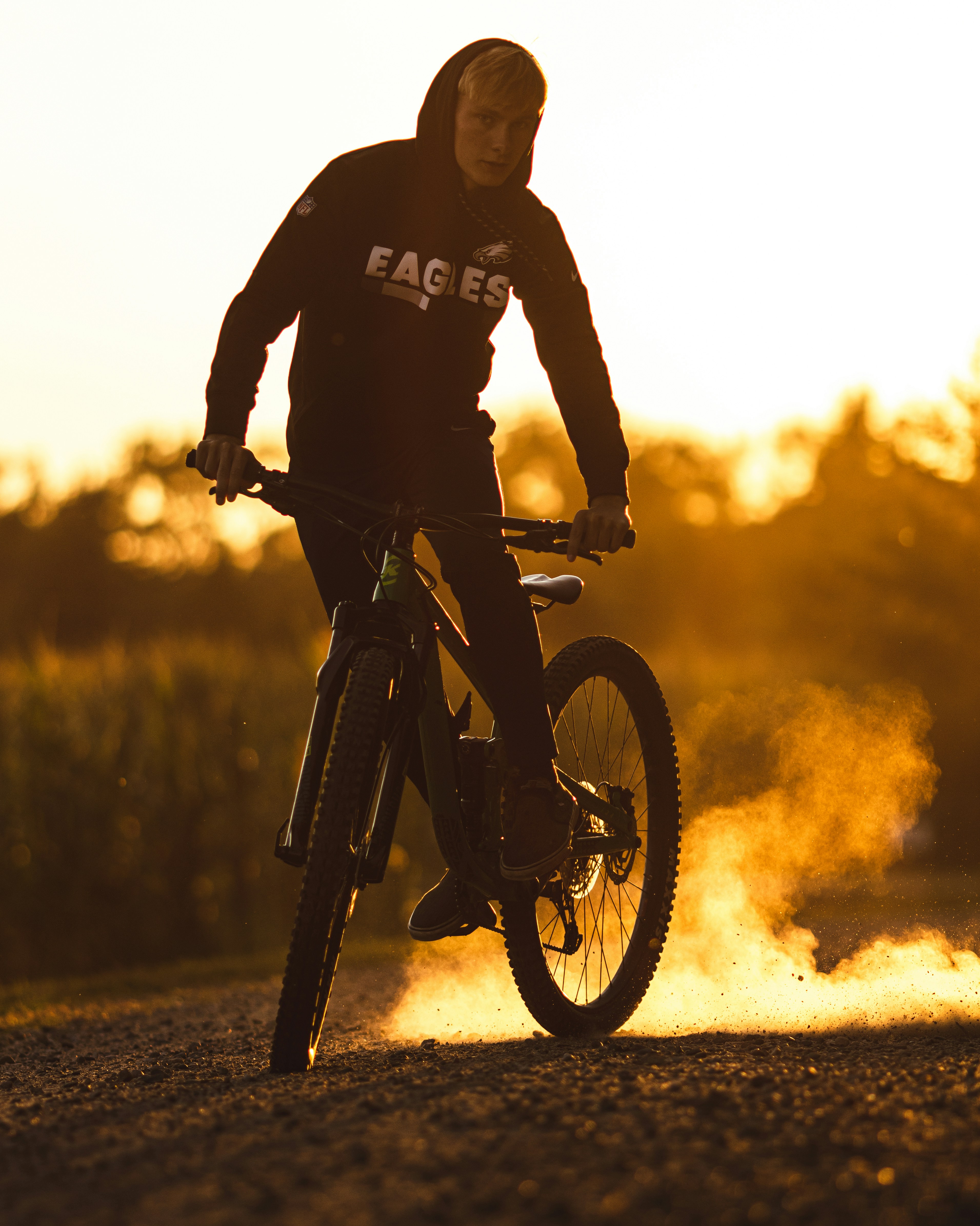 Silhouette Rider: Backlit BMX in Golden Hour Dust