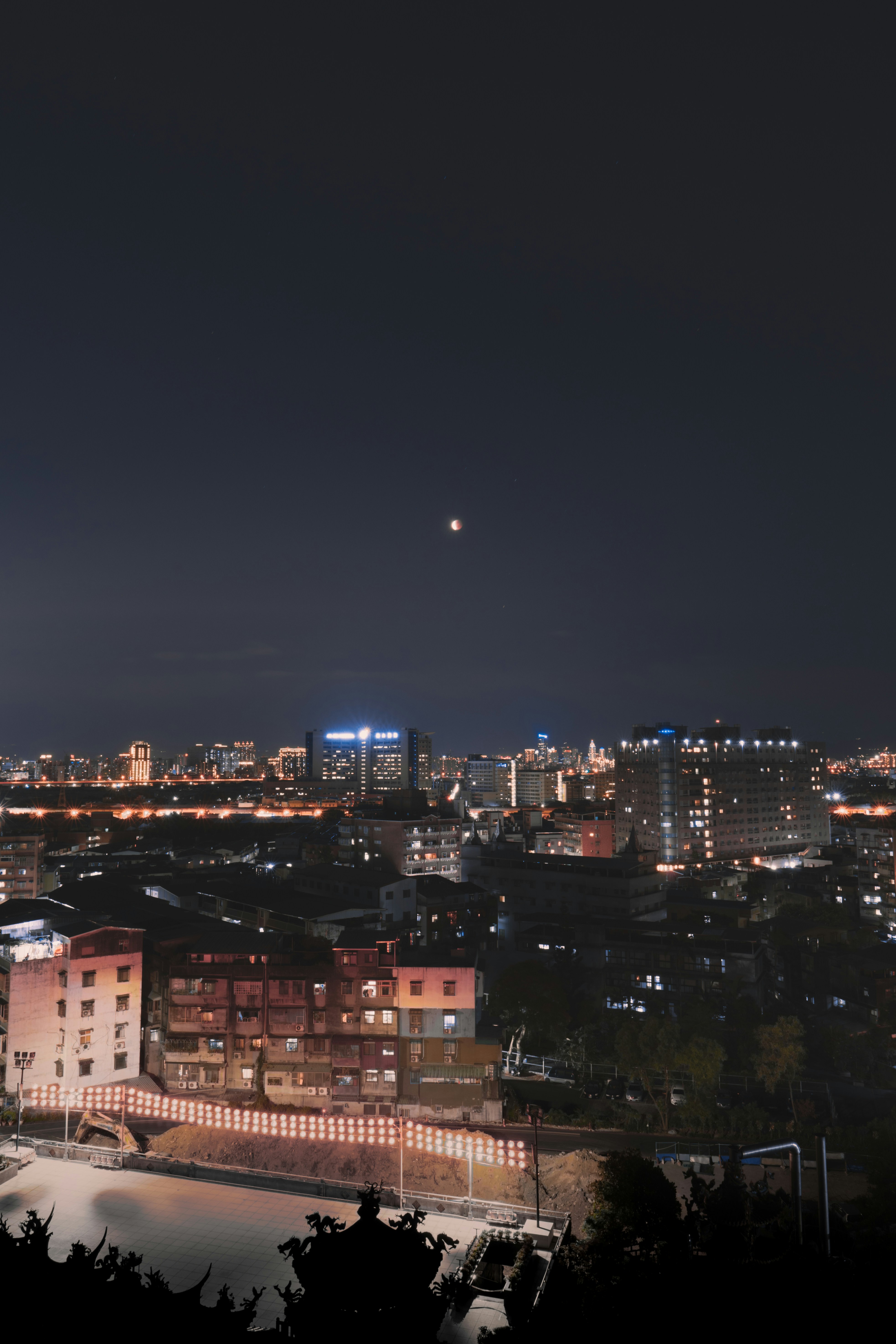 Moon Over the Riverside Skyline: Nightscape from a Hillside