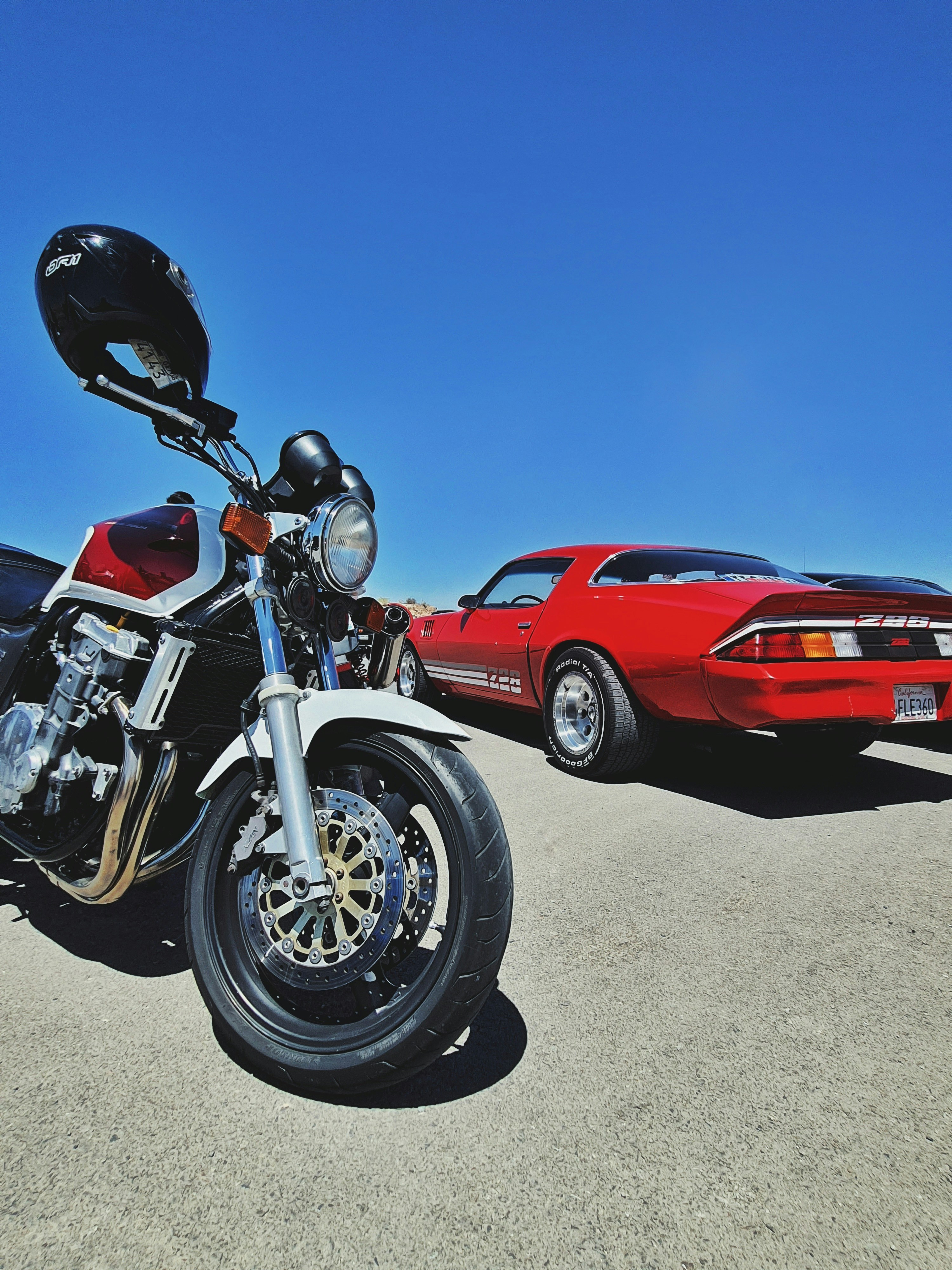 Red and black motorcycle on gray asphalt road during daytime photo ...