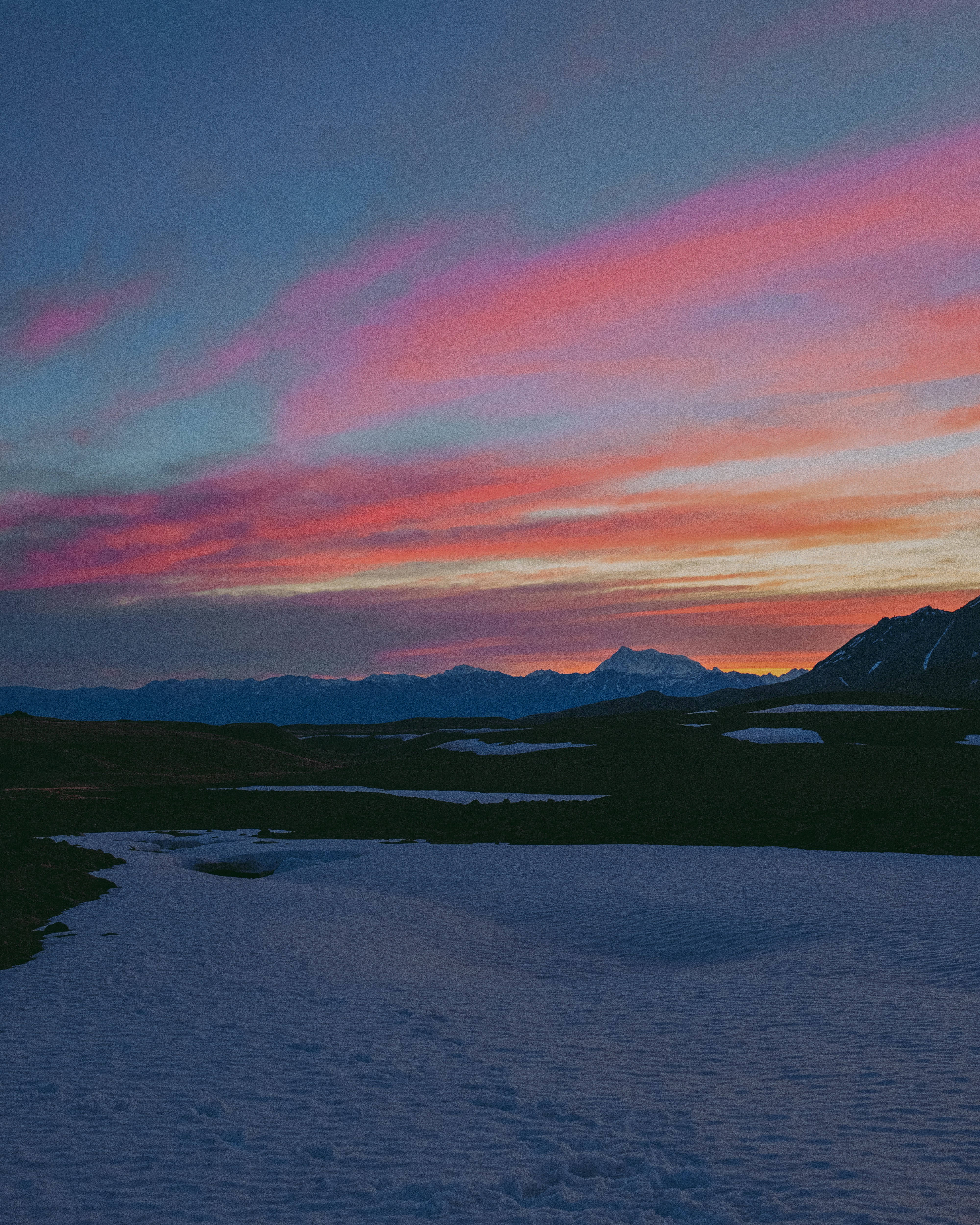 Dawn over Snow-stitched Valleys with Fjordic Peaks