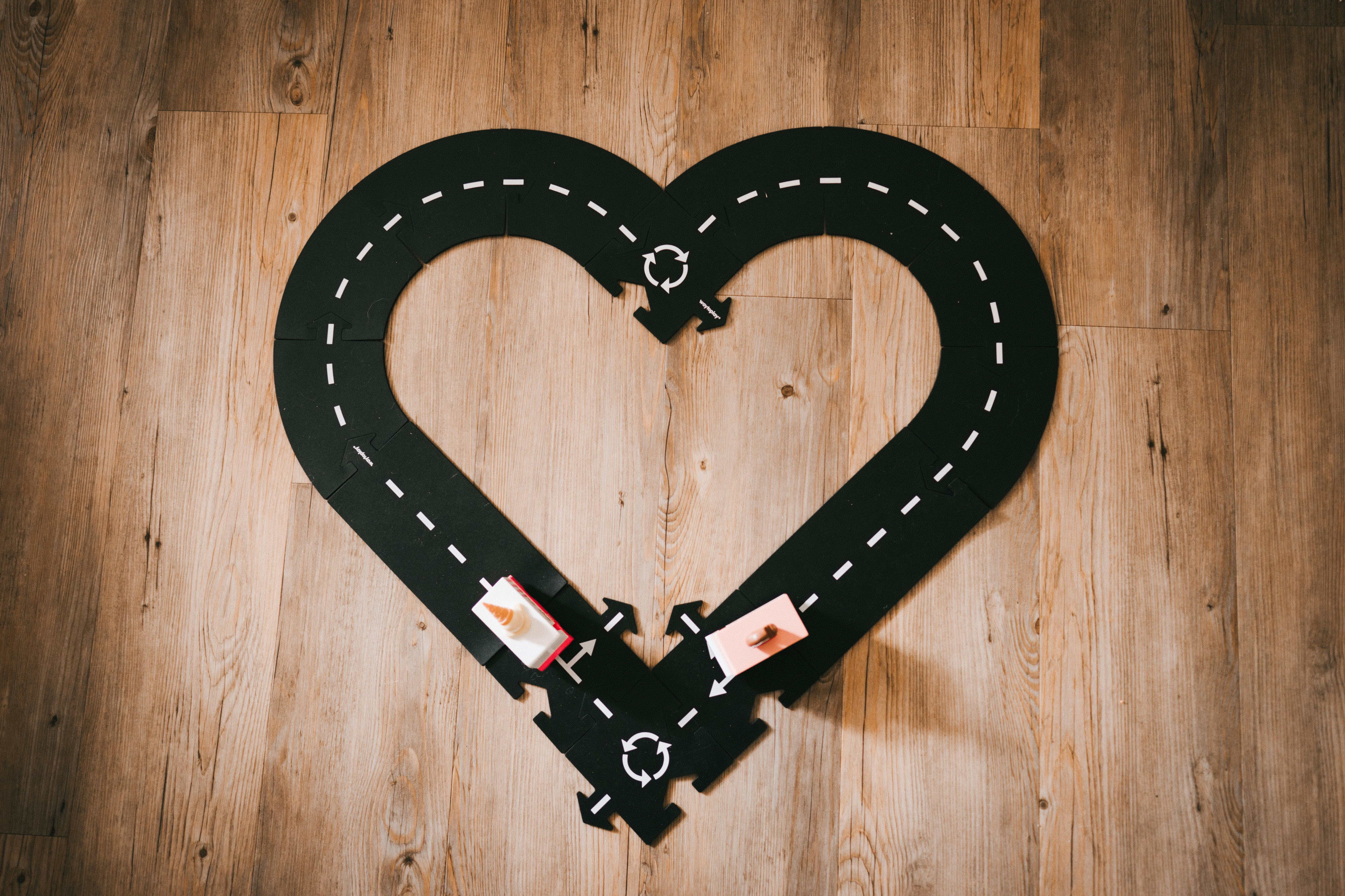 Heartbound Circuit: A Wooden Floor Track with Card Stops