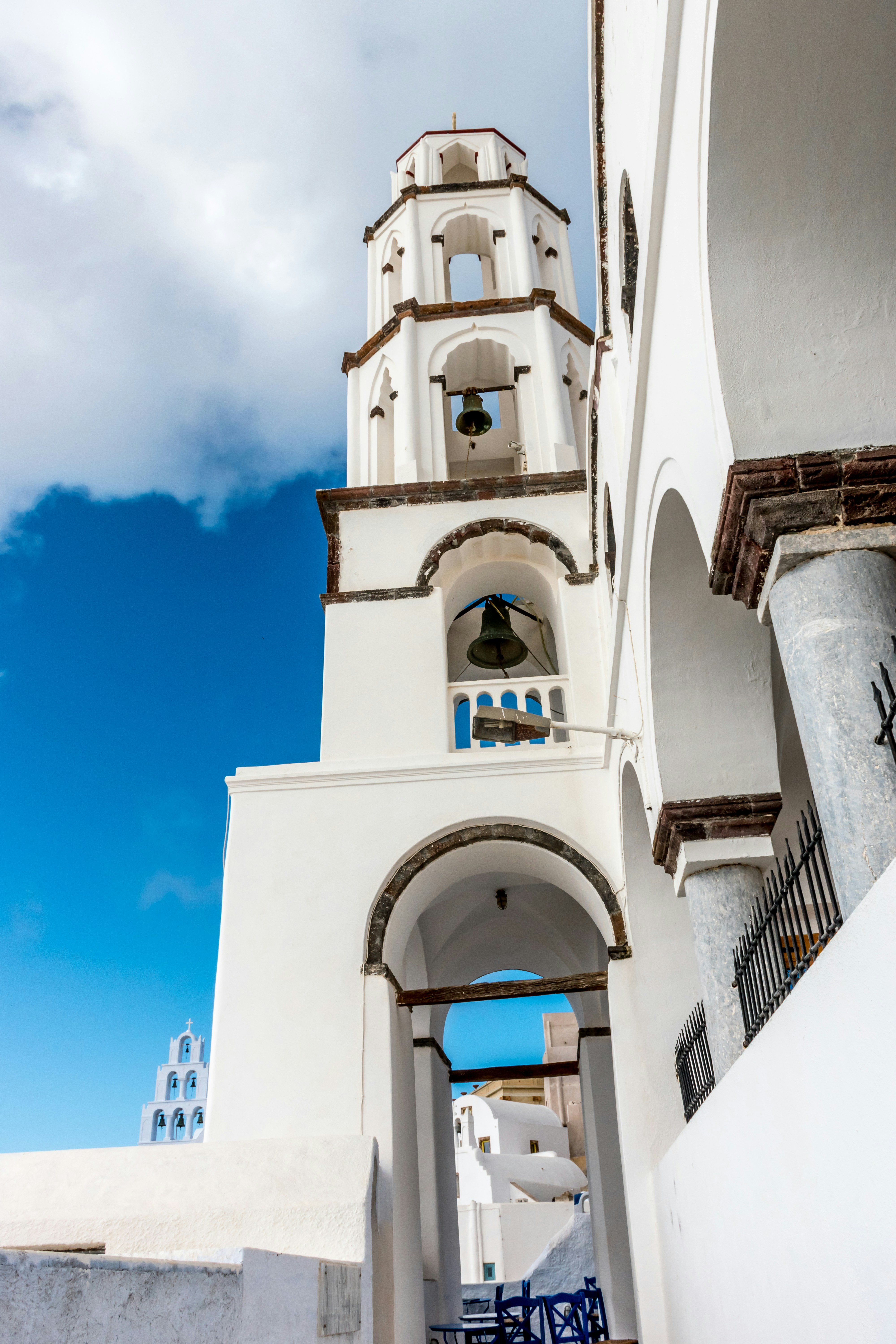 White Bell Tower Under a Bright Aegean Sky