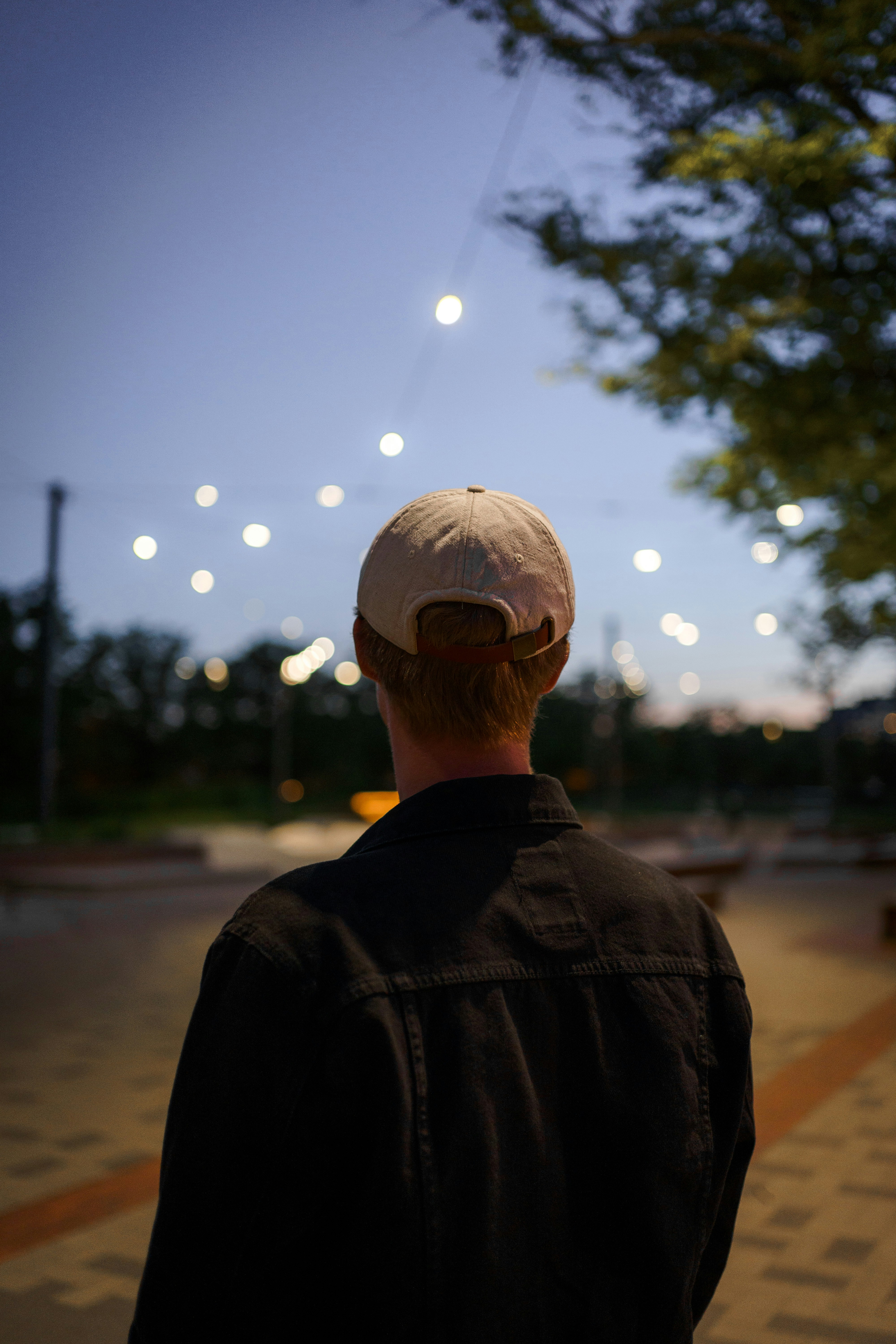 Under the Soft Orbs: A Night Portrait in a Park
