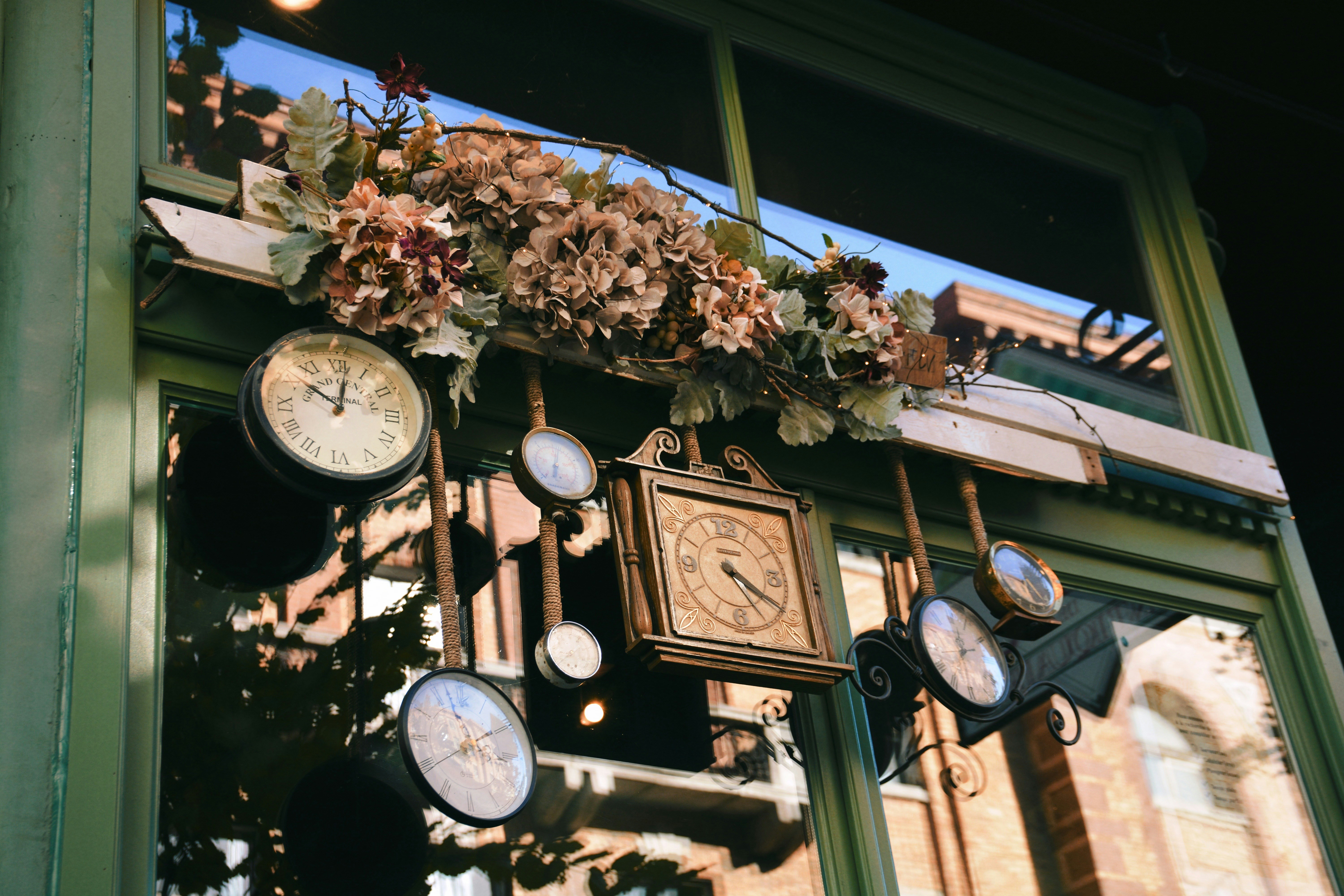 Garlanded Timekeepers: An Antique Clock Shop Window