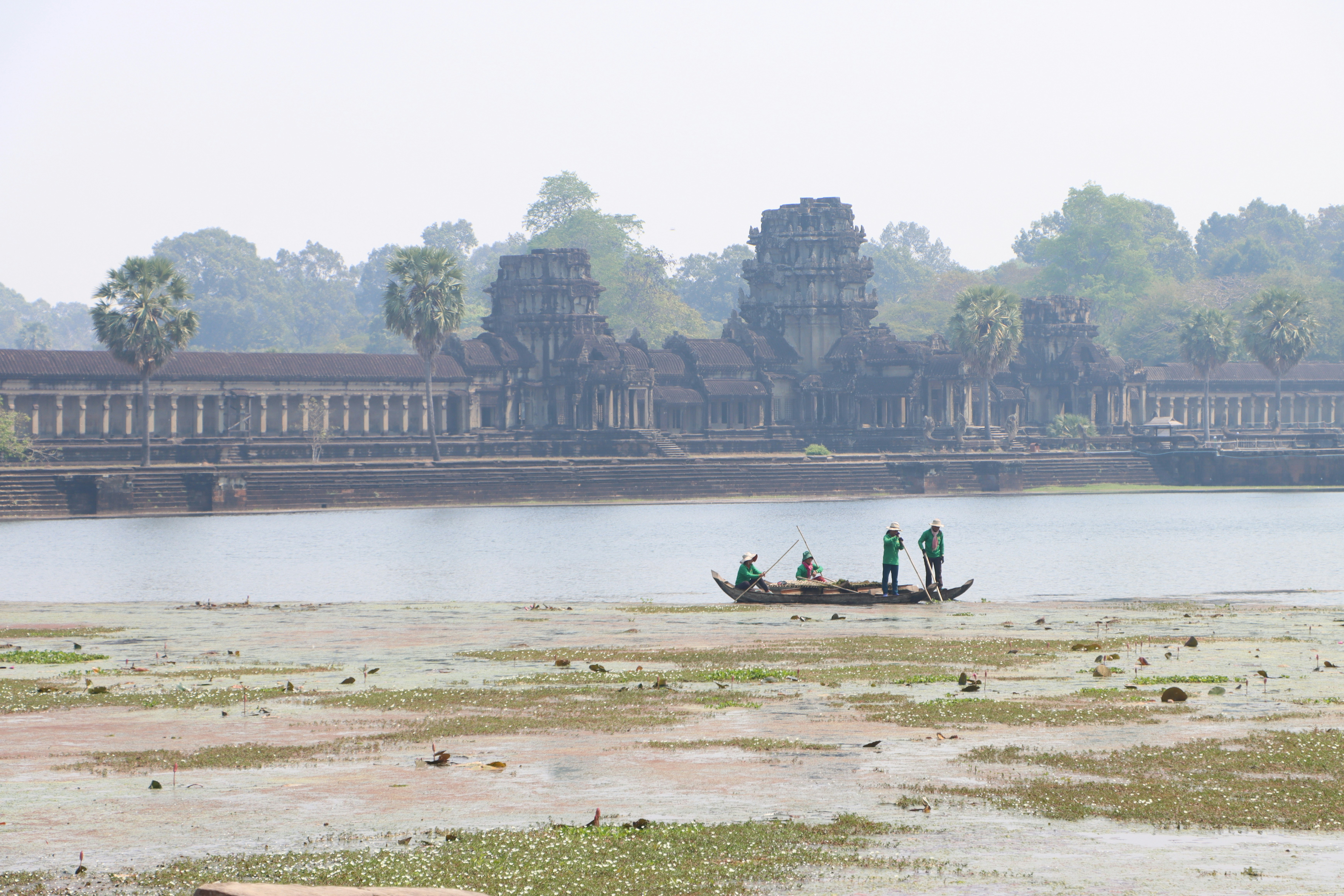 Boat's Slow Approach to a Distant Stone Temple