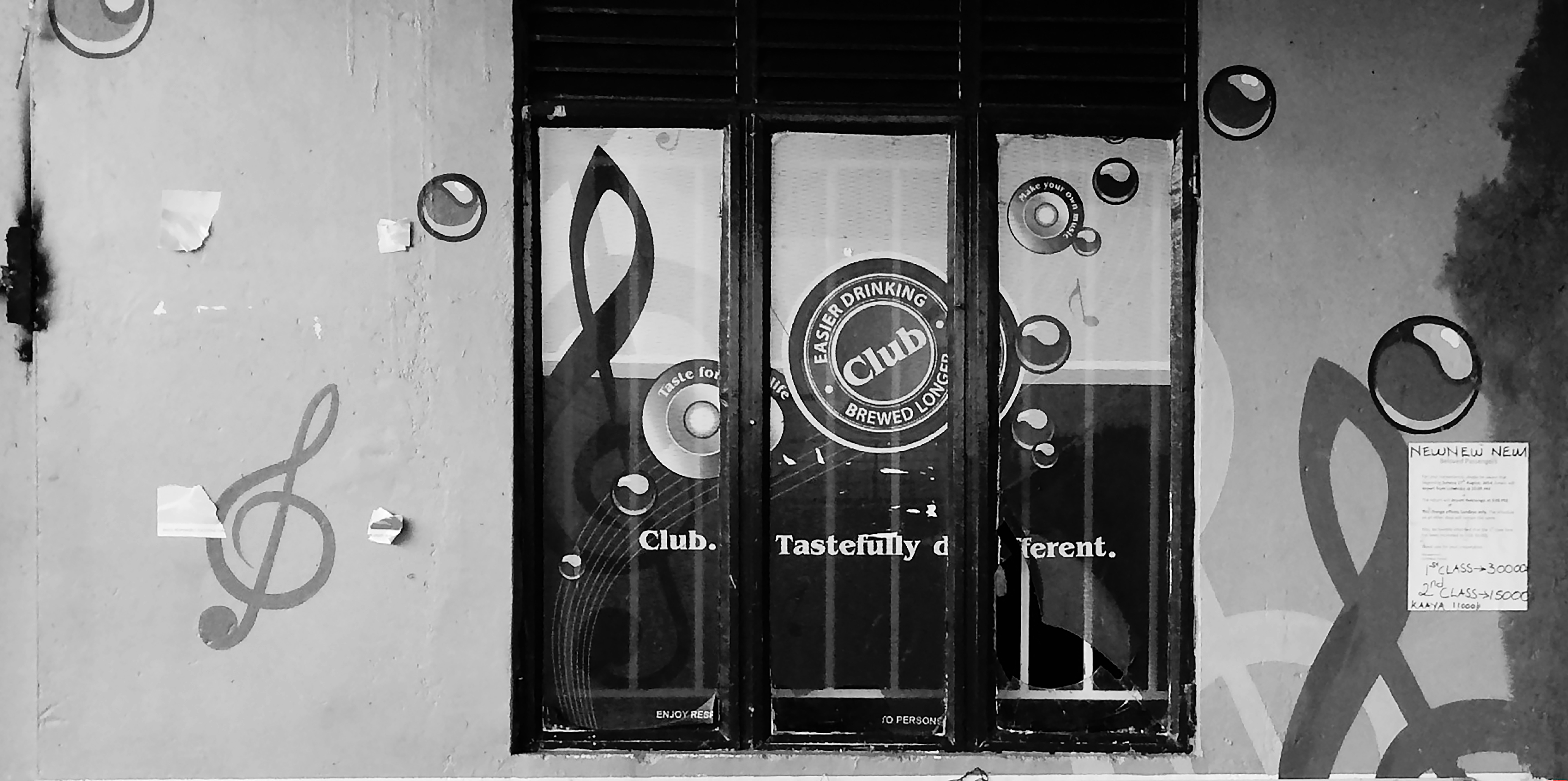 Centerpiece in Monochrome: Circular Club Logo Behind Painted Glass