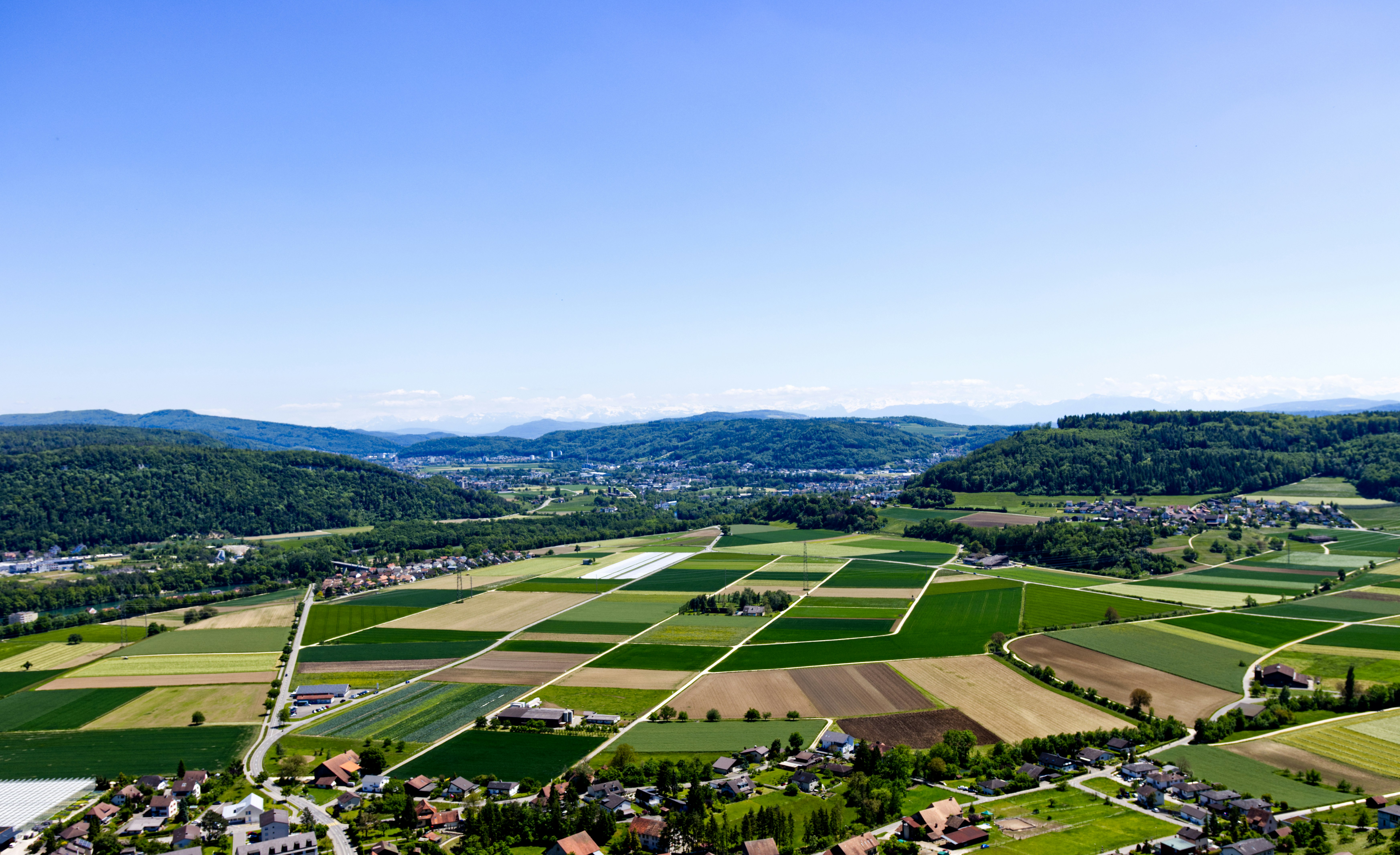 Valley Patchwork: Aerial Quilt of Fields and Villages