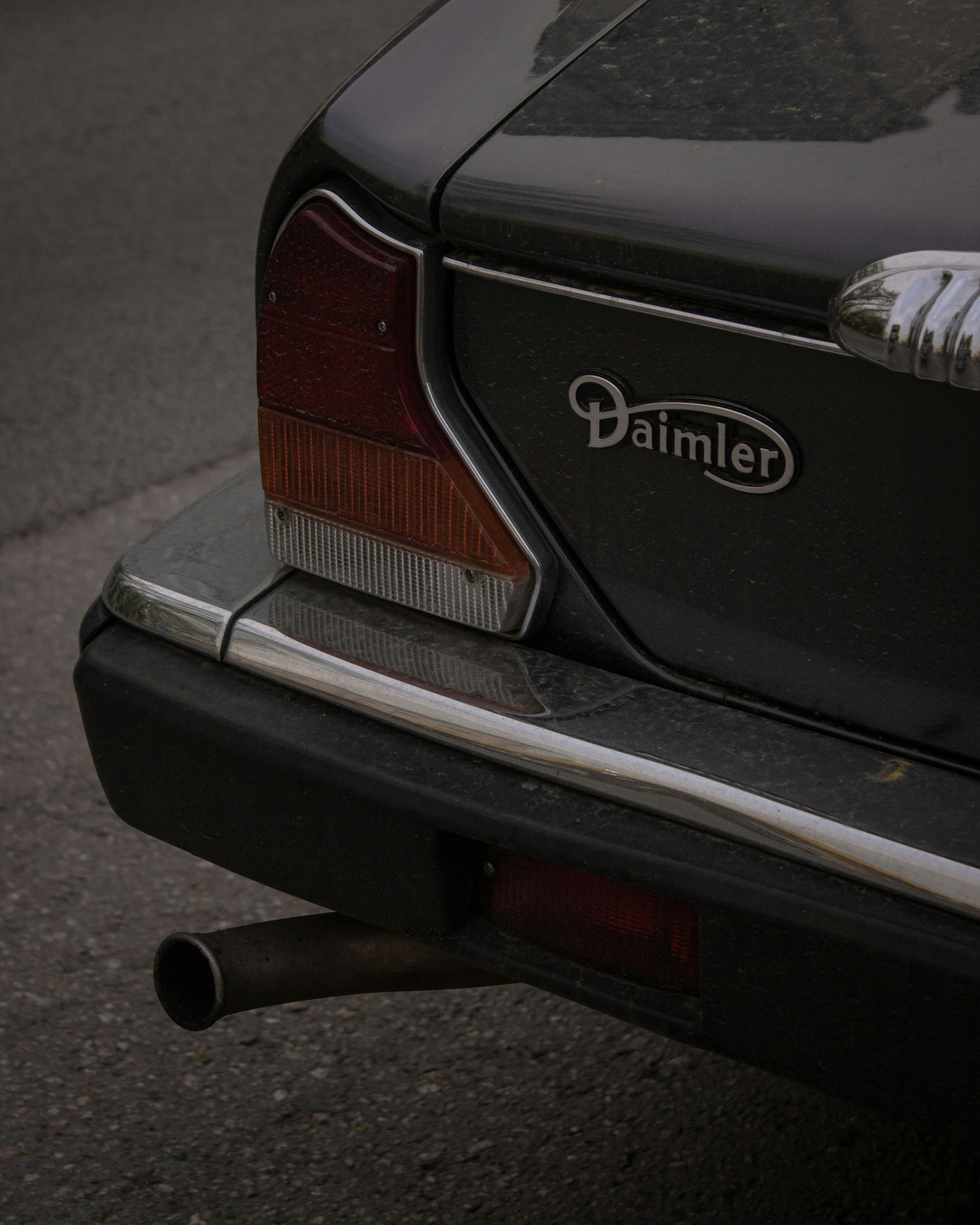 Daimler Emblem in Dusk: A Vintage Tail End in Chrome and Shadow