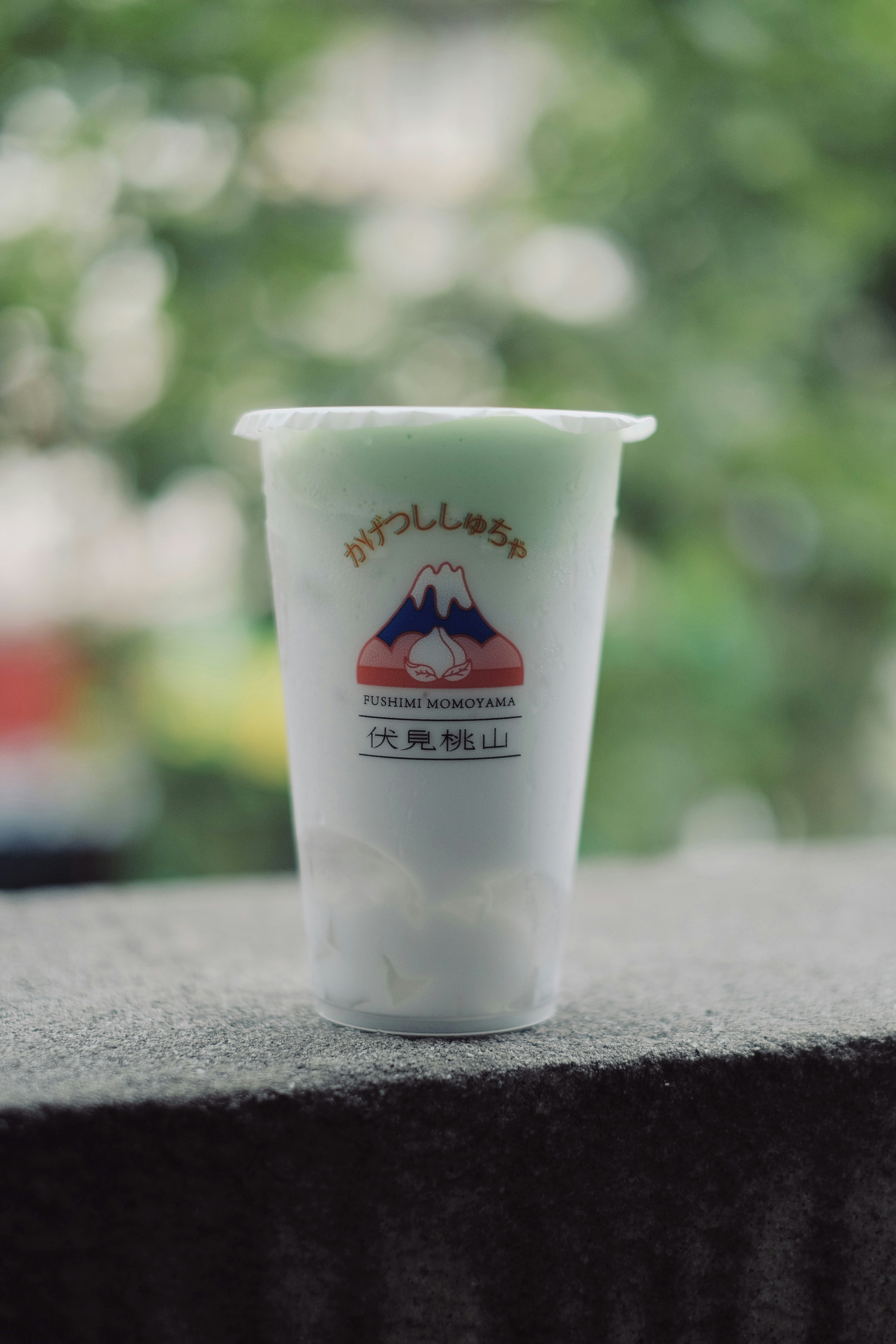 Cup with Mount Fuji Emblem on a Quiet Balcony Backdrop