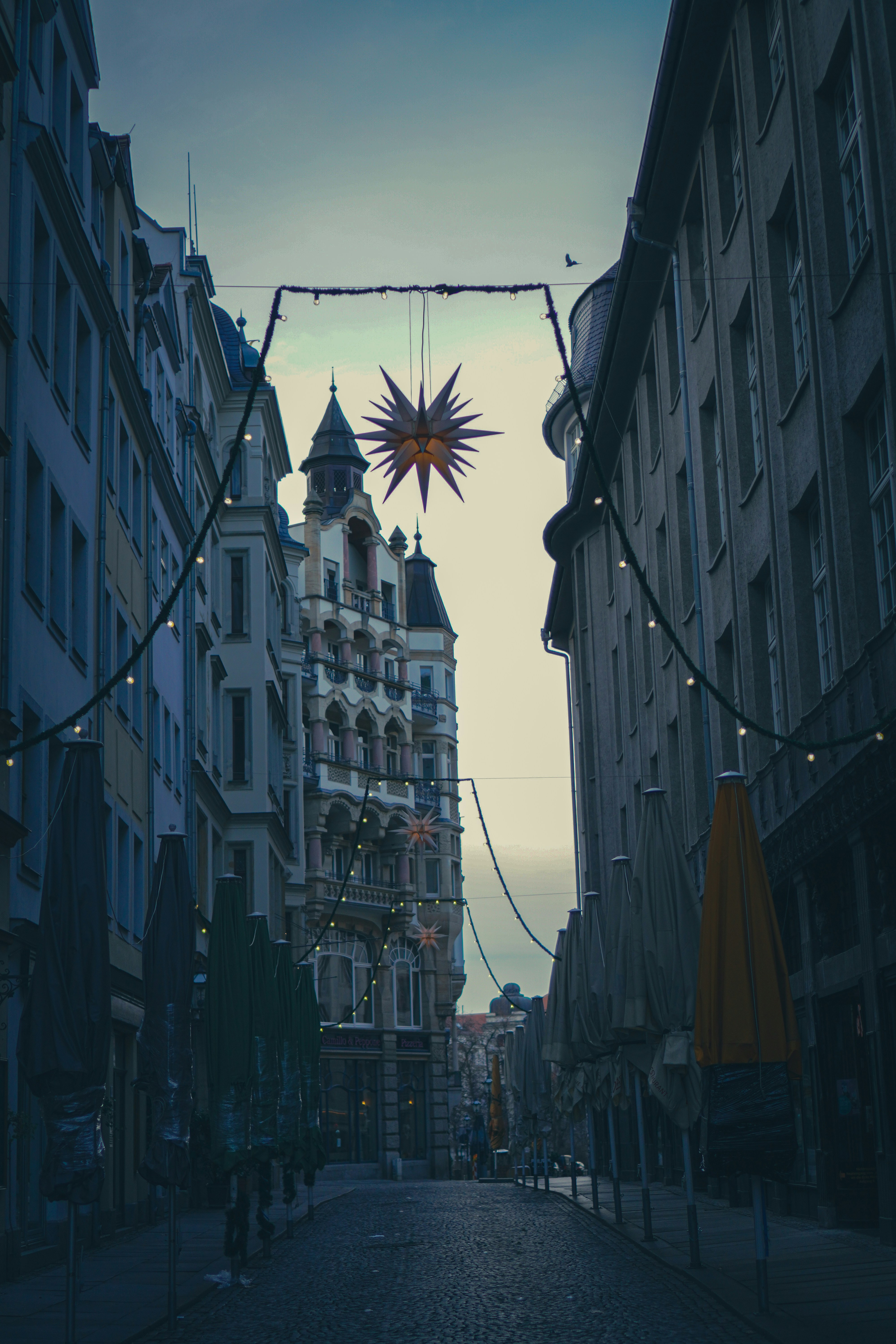 Midnight Star Over a Narrow European Street