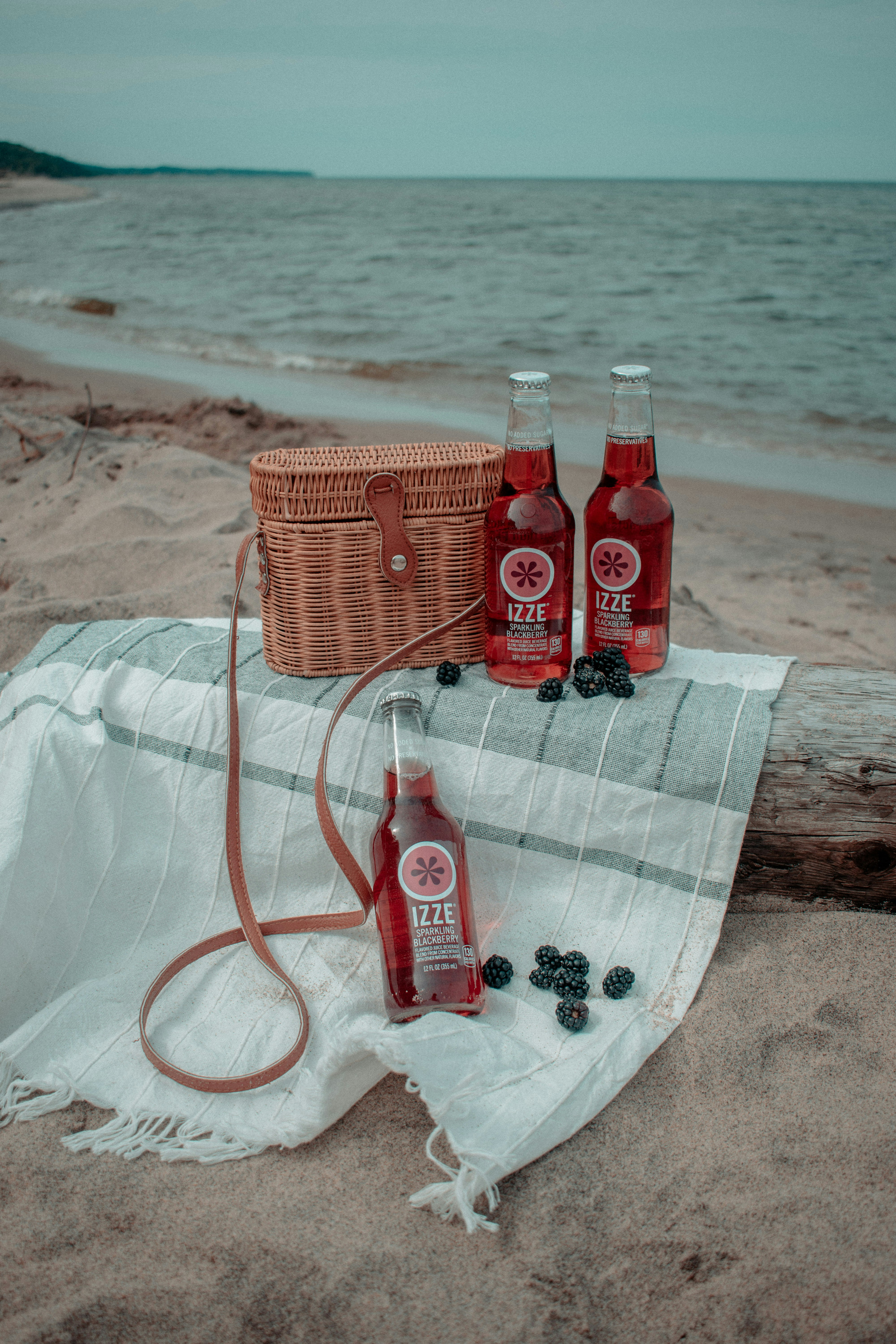 red plastic bottles on white textile