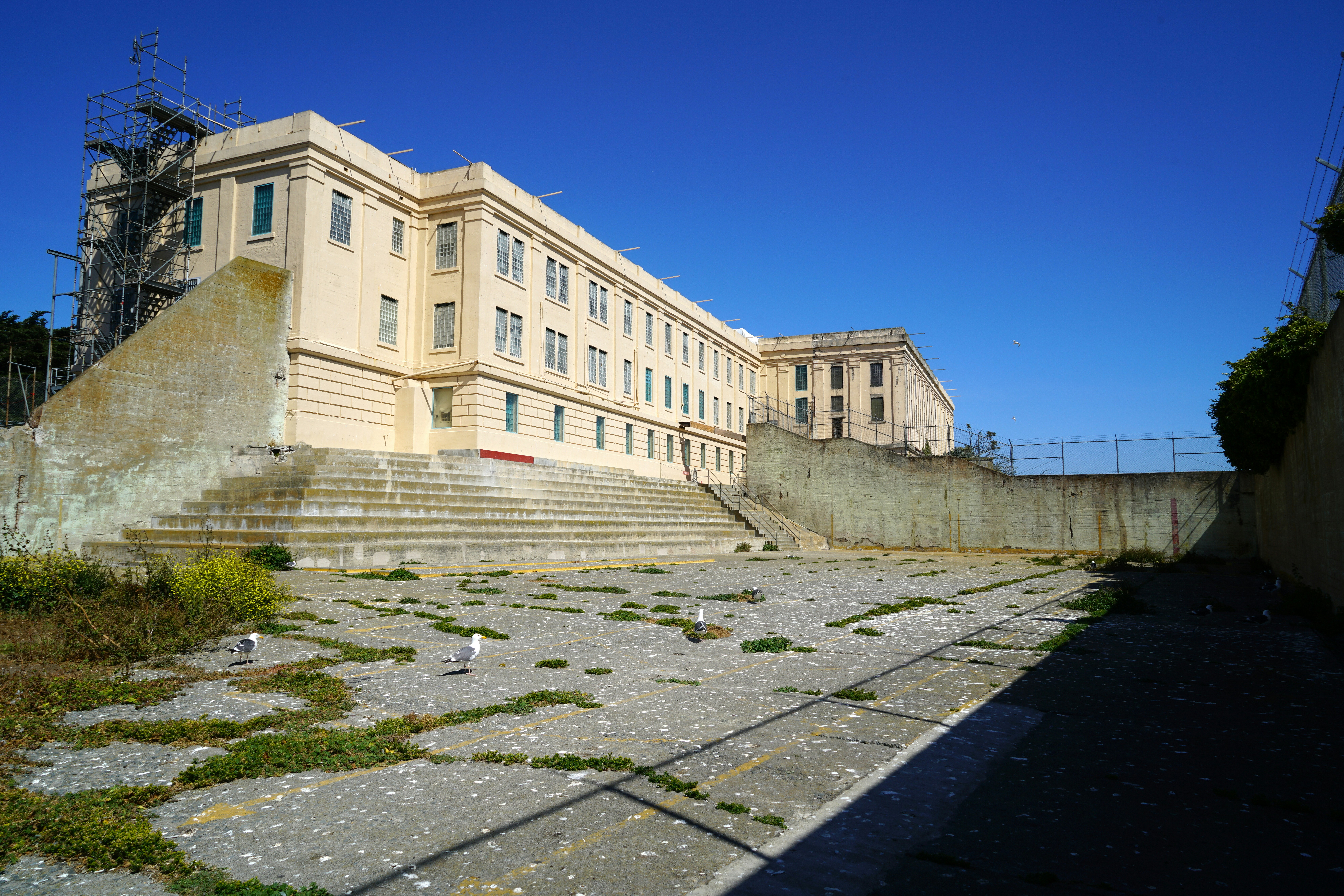 The Recreation Yard was the yard used by inmates of Alcatraz Federal Penitentiary between 1934 and 1963. 

In 1936, the previously dirt-covered yard was paved. The yard was part of the most violent escape attempt from Alcatraz in May 1946 when a group of inmates hatched a plot to obtain the key into the recreation yard, kill the tower guards, take hostages, and use them as shields to reach the dock.[7] During the Occupation of Alcatraz in 1970, between 400 and 700 Native Indians assembled in the recreation yard and demonstrated.