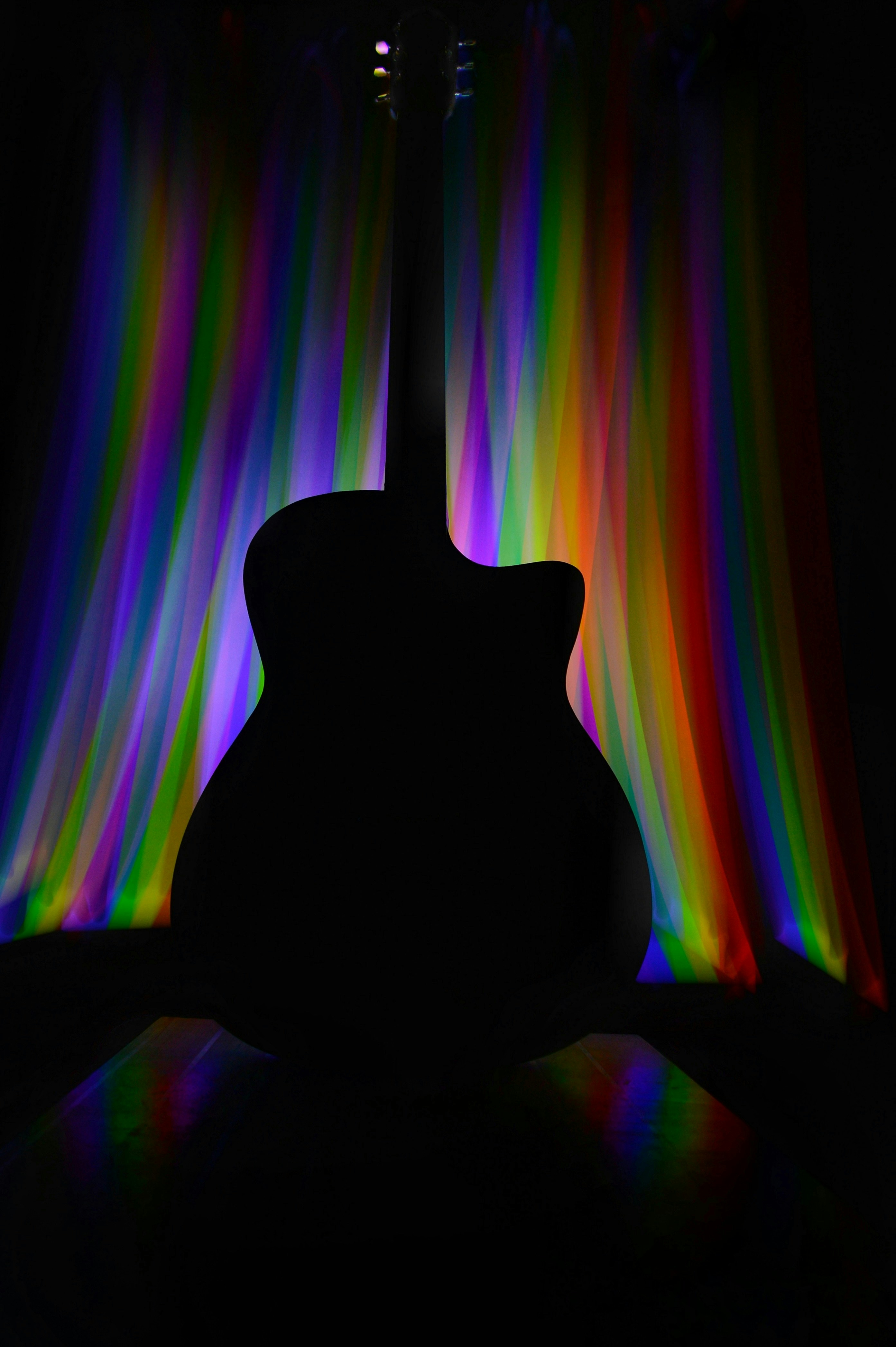 Silhouette Symphony: Guitar Against a Prism of Light