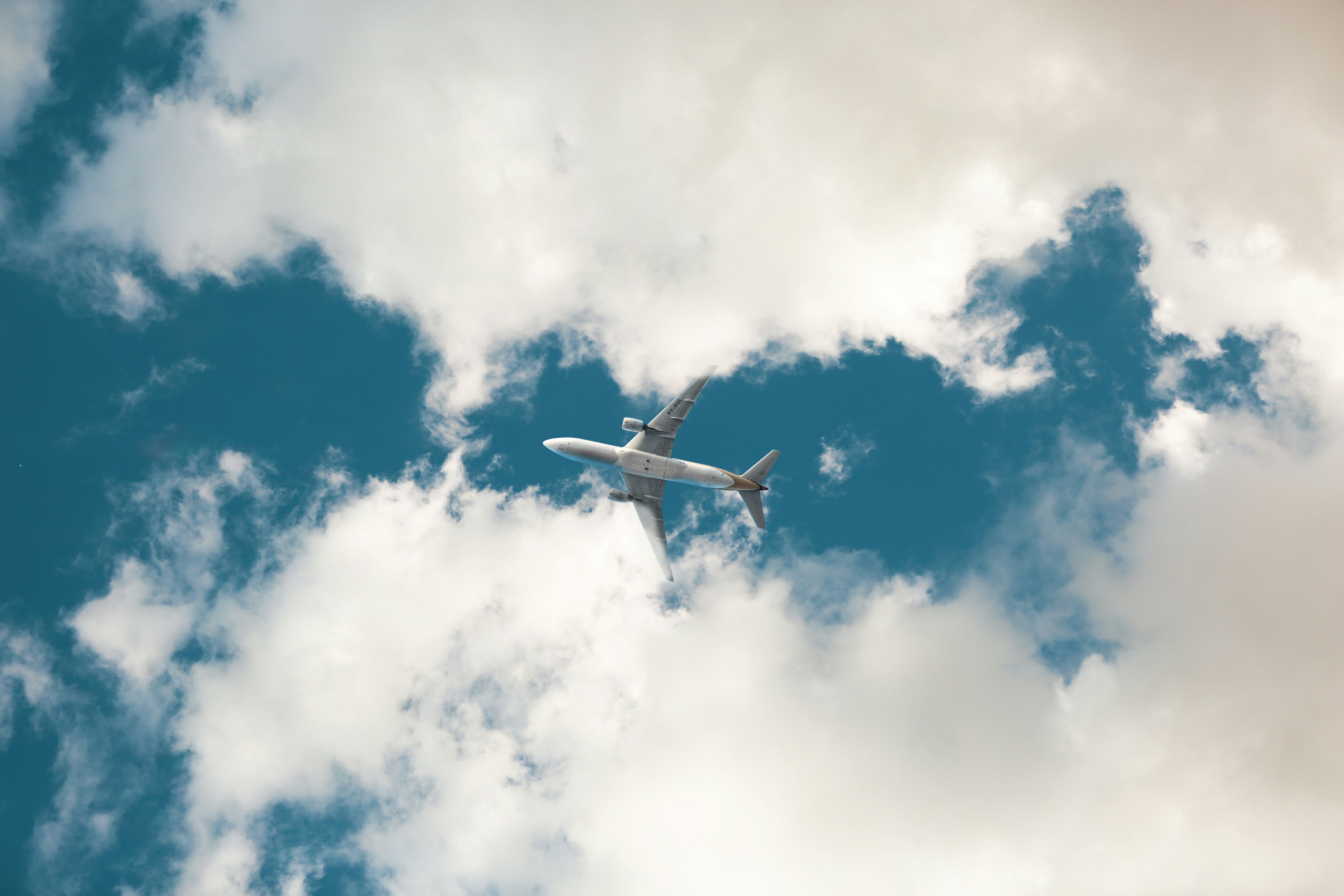 White airplane flying under blue sky during daytime photo – Free Blue ...