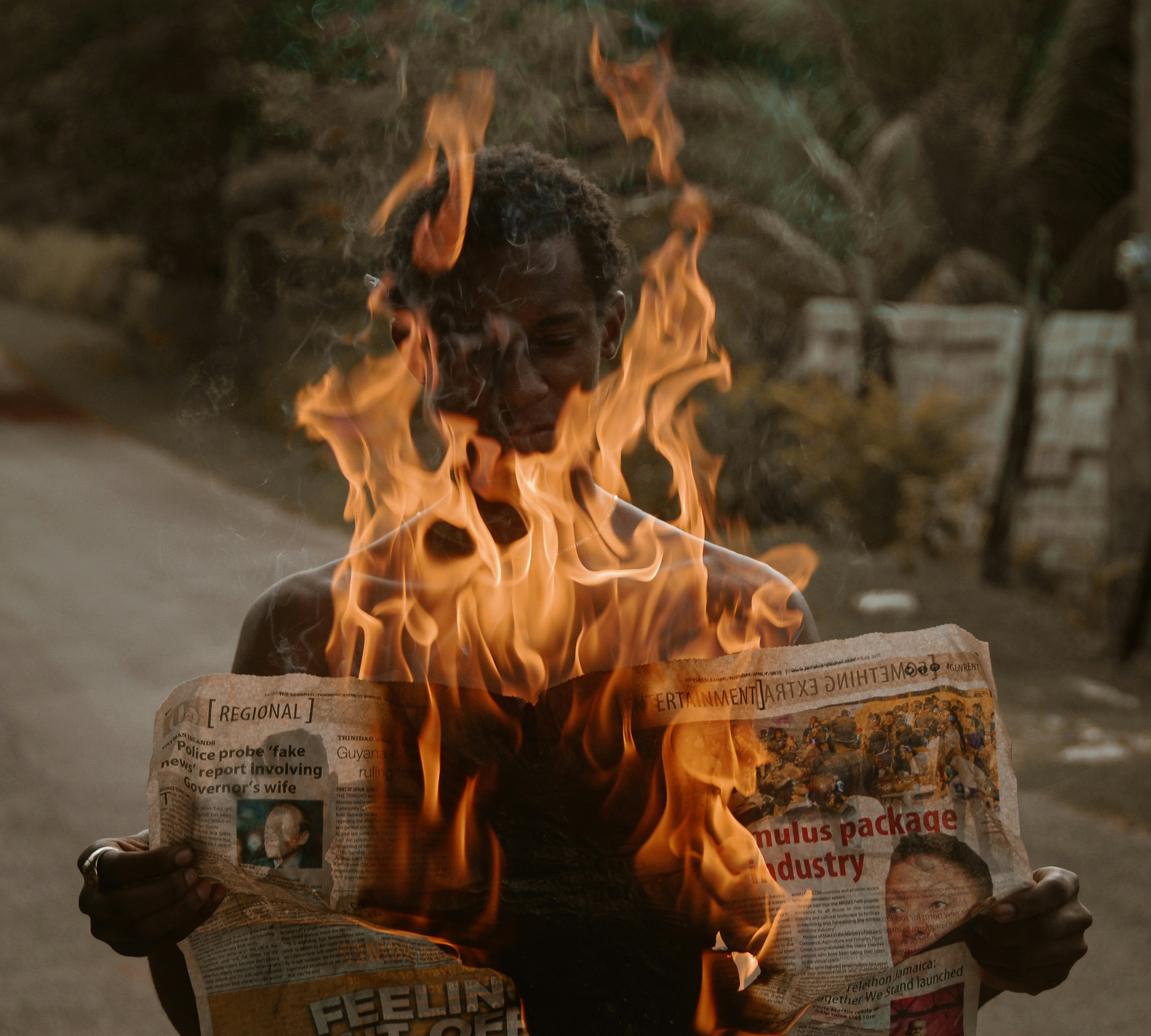 Flame-Consumed Headlines: A Portrait Reading Fire