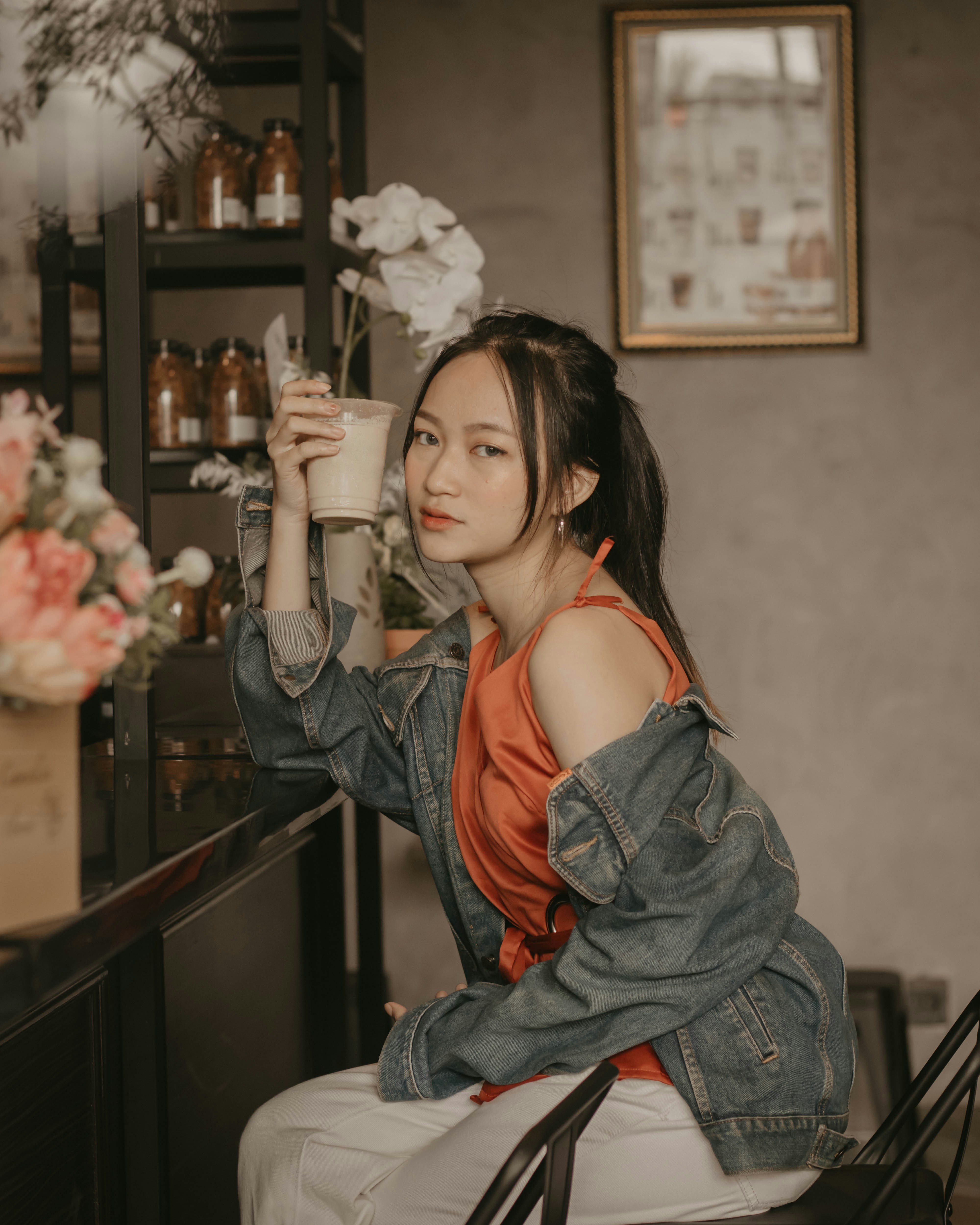 Red Silk and Denim: Quiet Confidence at a Cozy Café