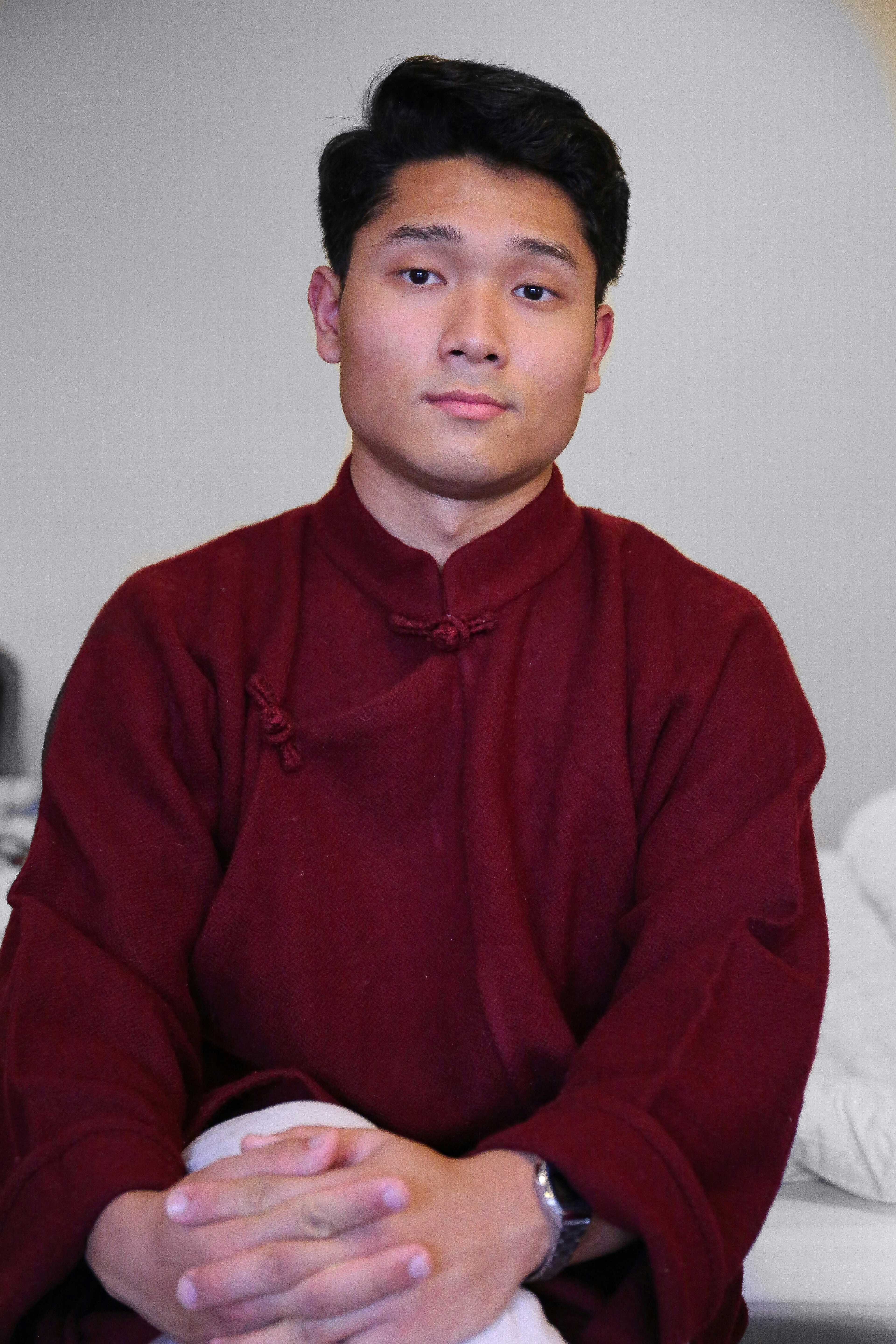 Maroon Mandarin Portrait: Subtle Confidence in a Quiet Studio