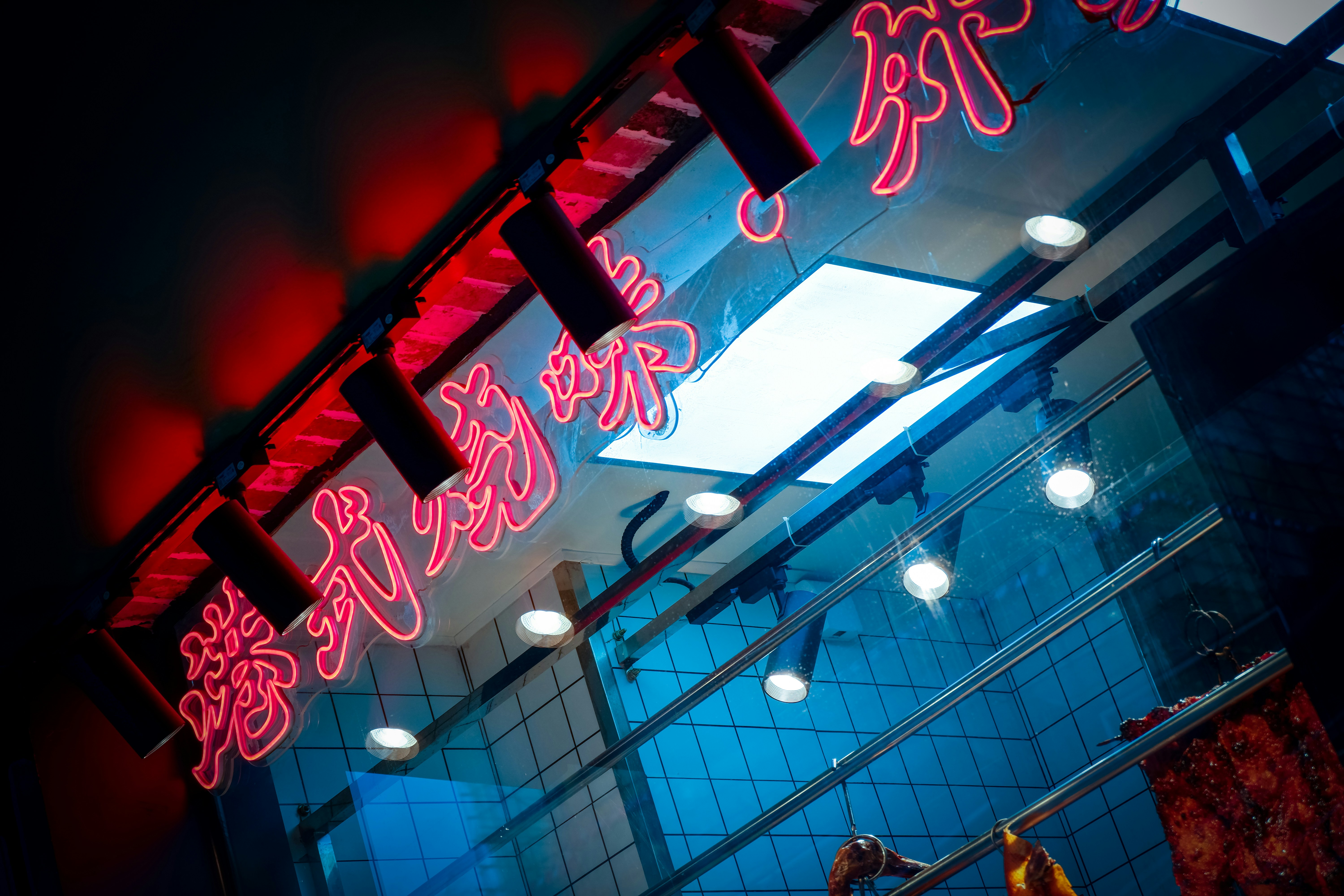 Neon Glimmer Over a Glass Facade