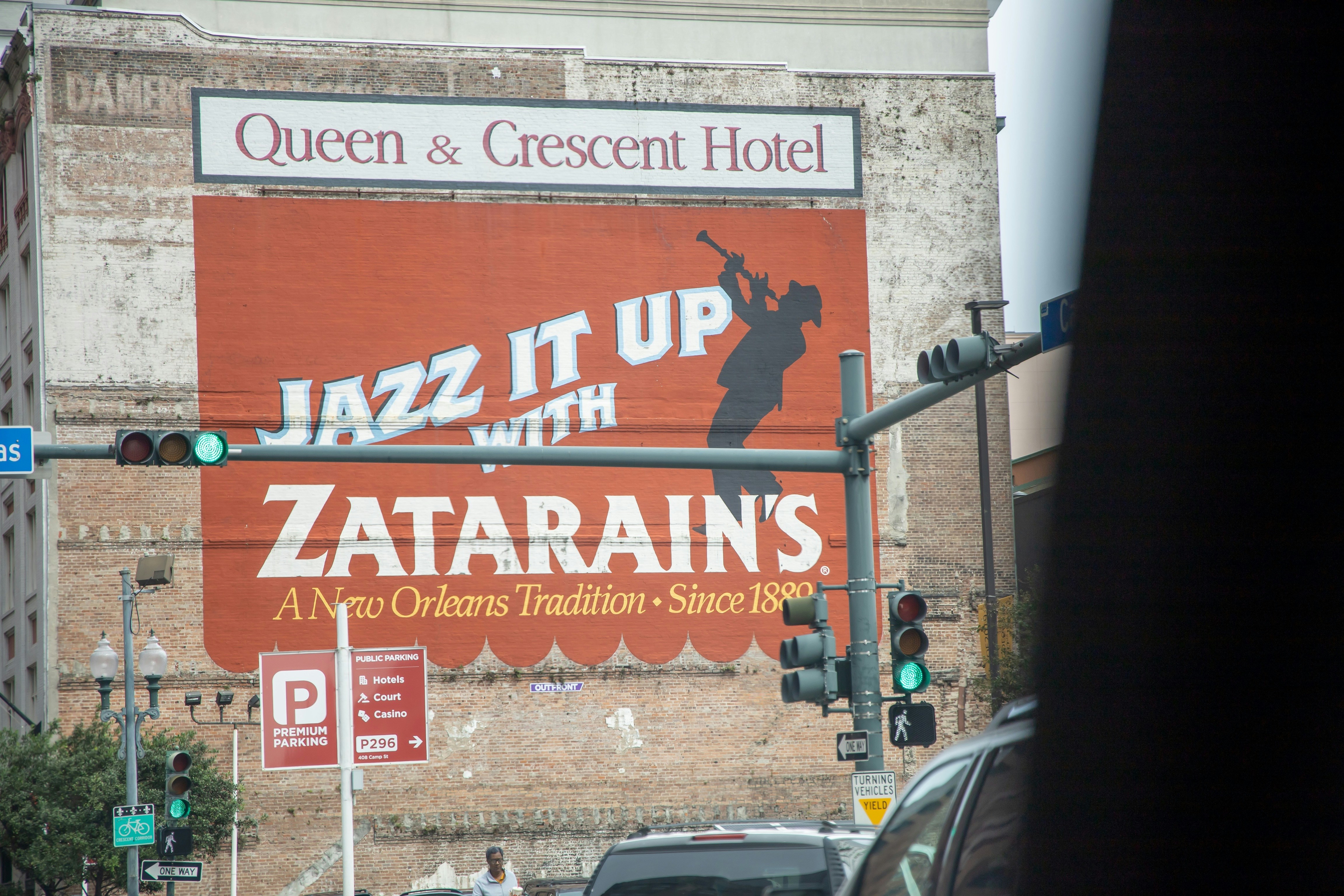 A large sign on the side of a building that says jazz it up with za ...