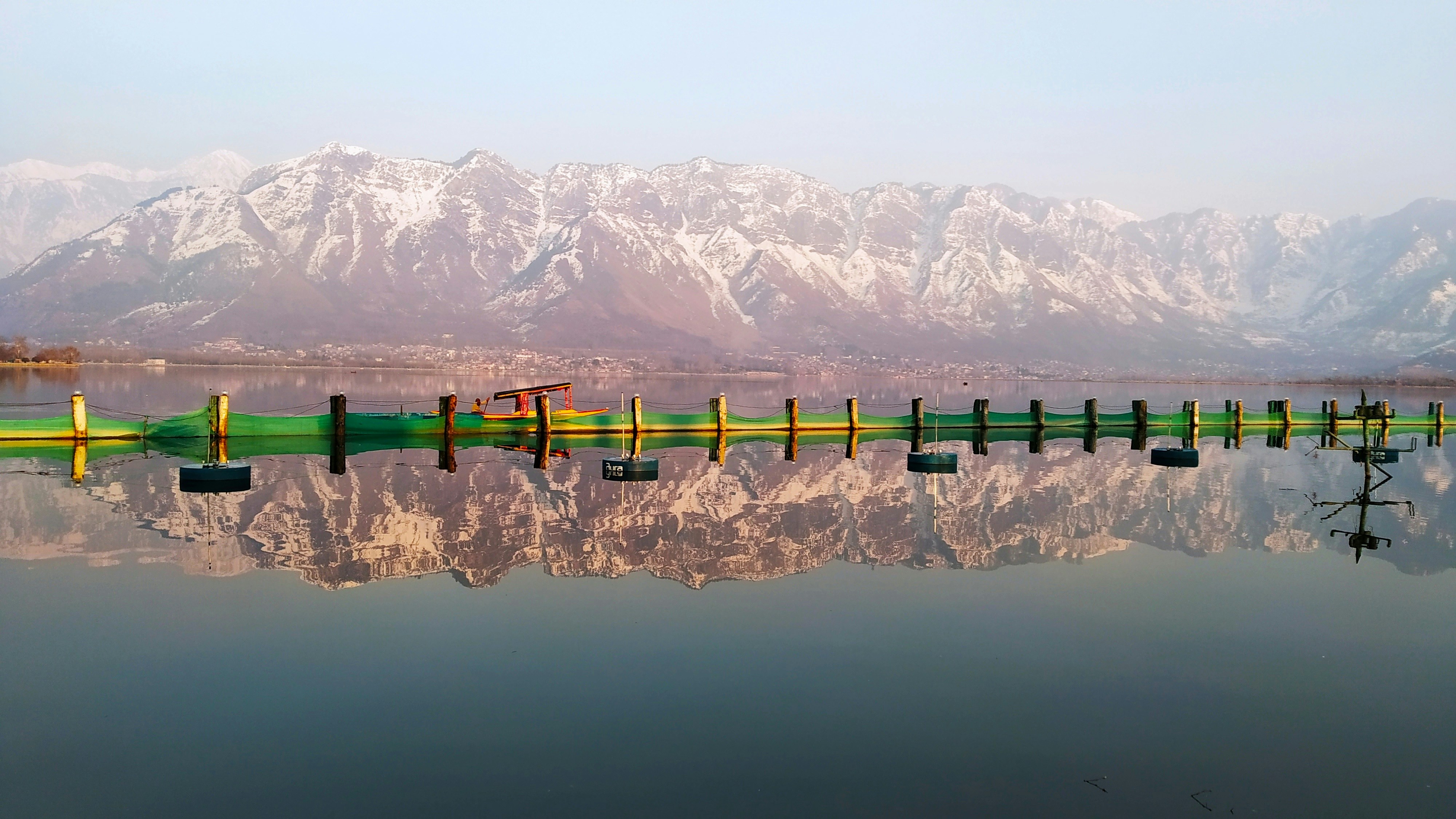 Serene Reflection of Snow-Capped Peaks