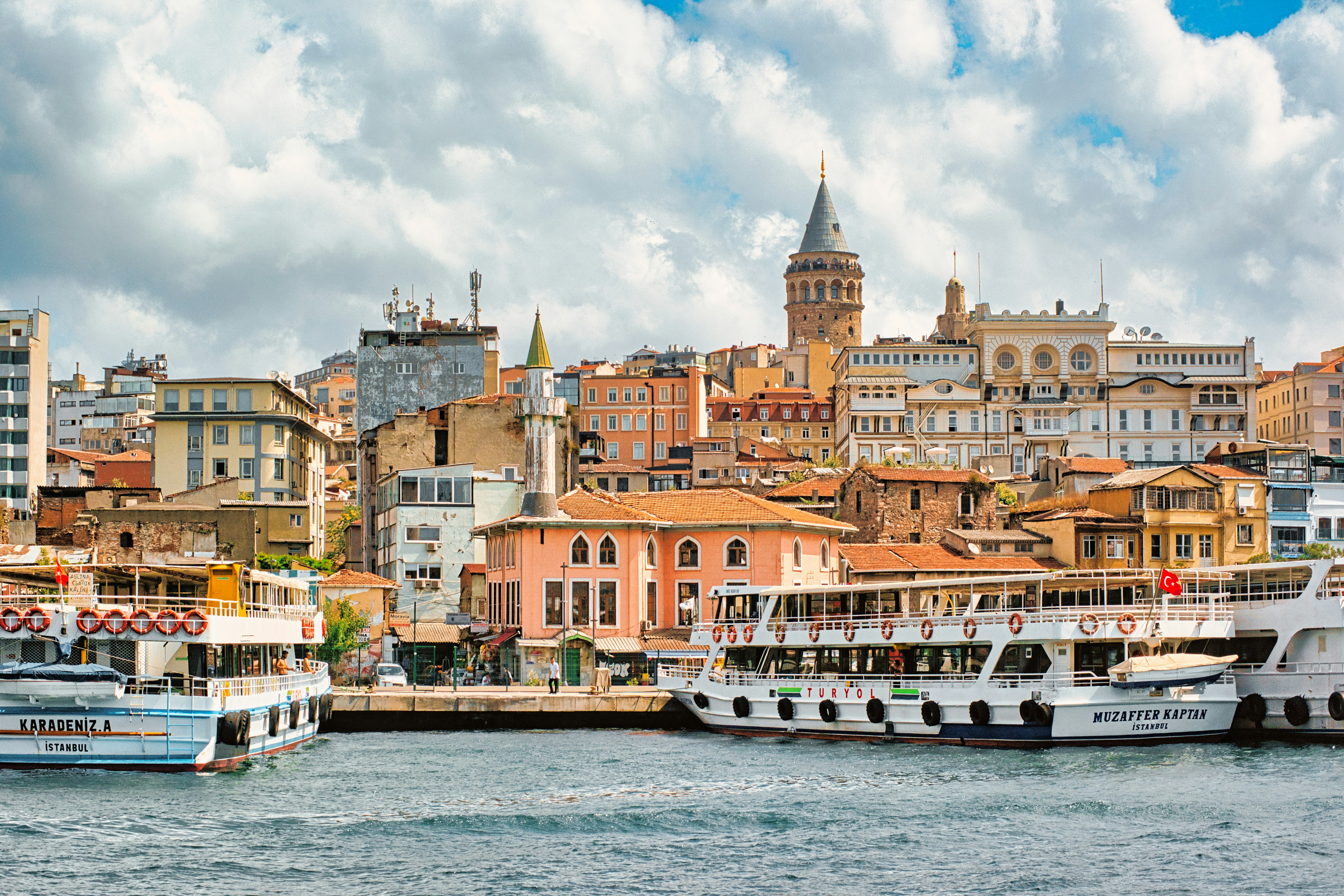 Galata view from the Golden Horn | white and black boat on water near buildings during daytime