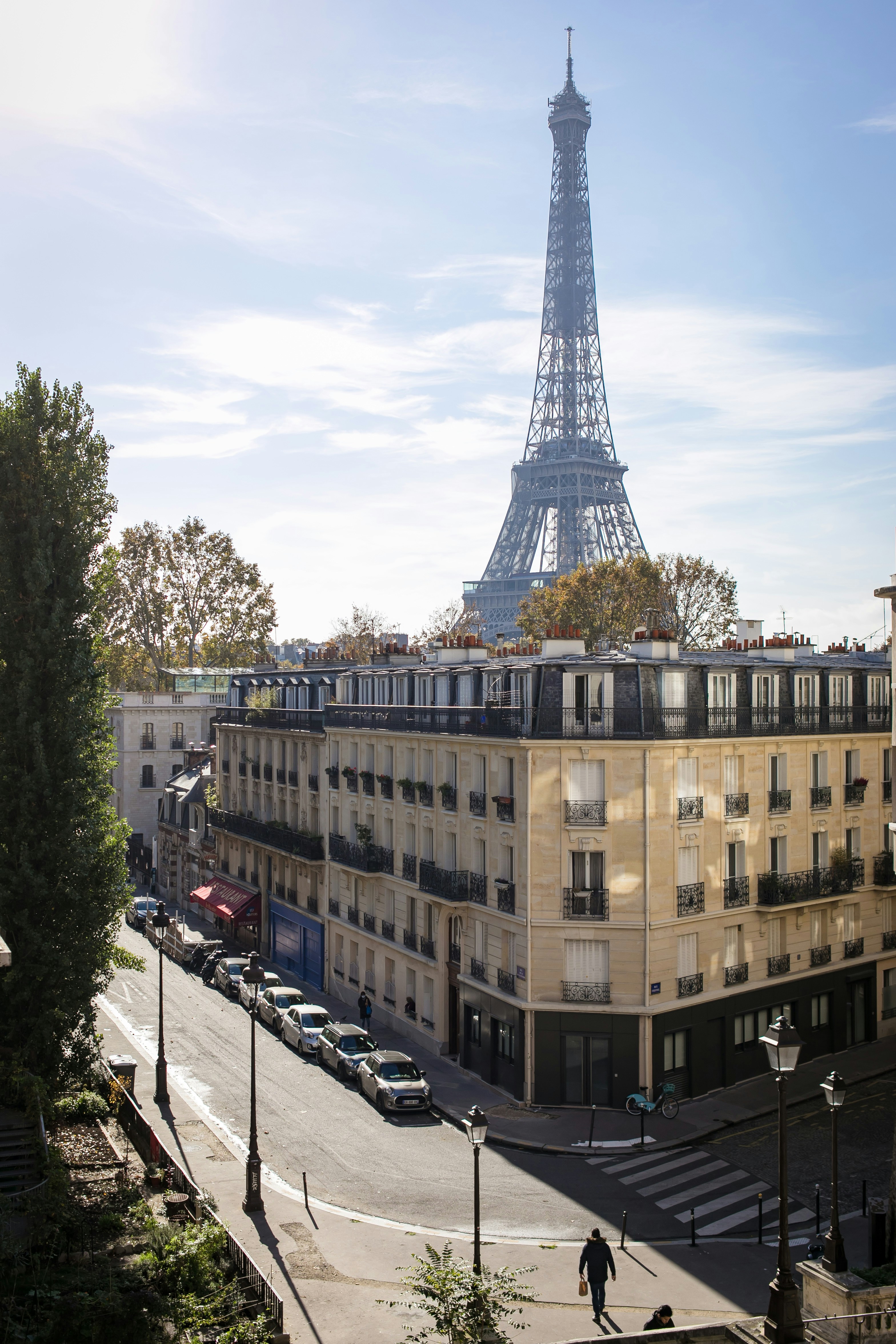 Eiffel Tower Above a Sunlit Parisian Street