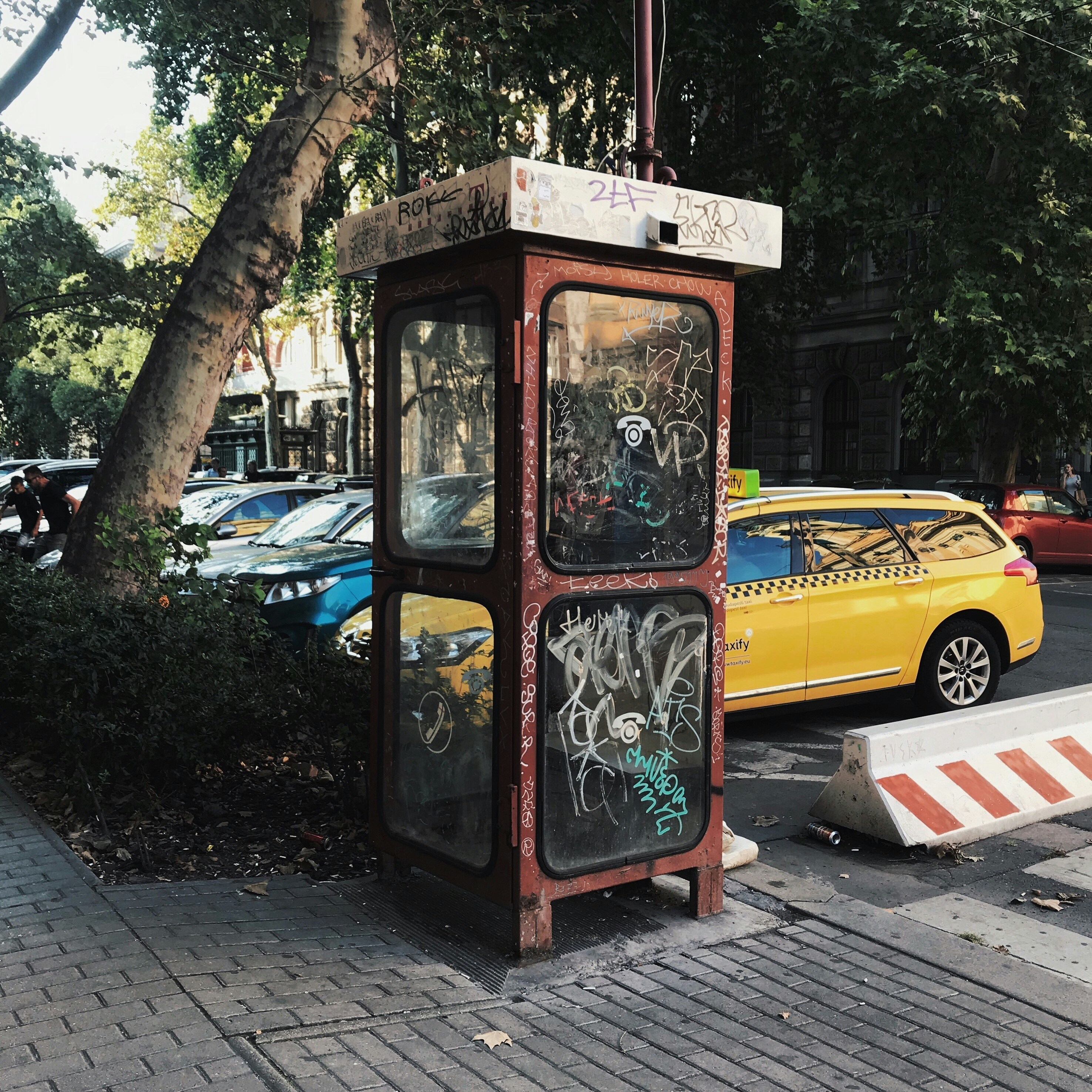 blue and yellow telephone booth