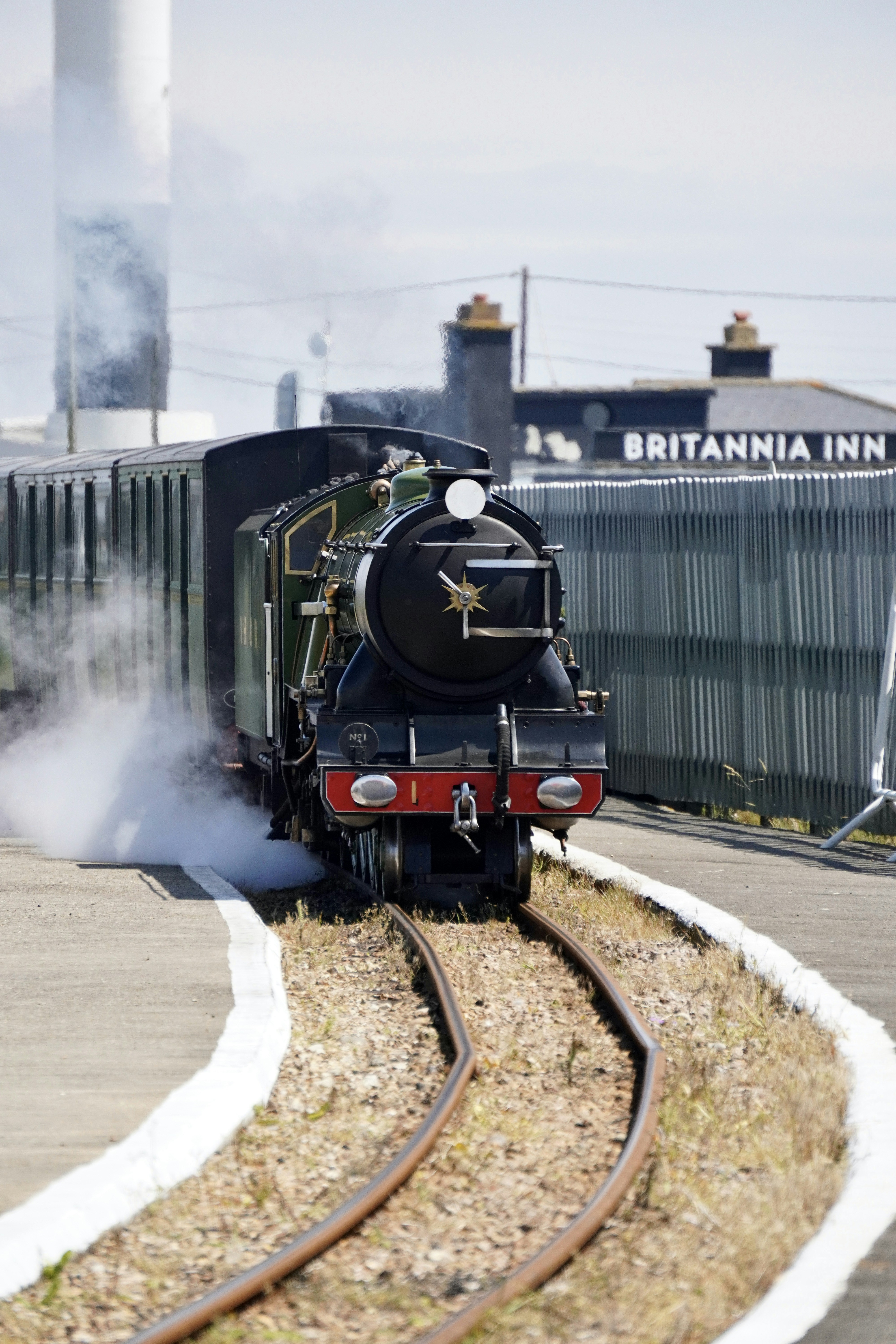 Black and red train on rail tracks during daytime photo – Free Train ...